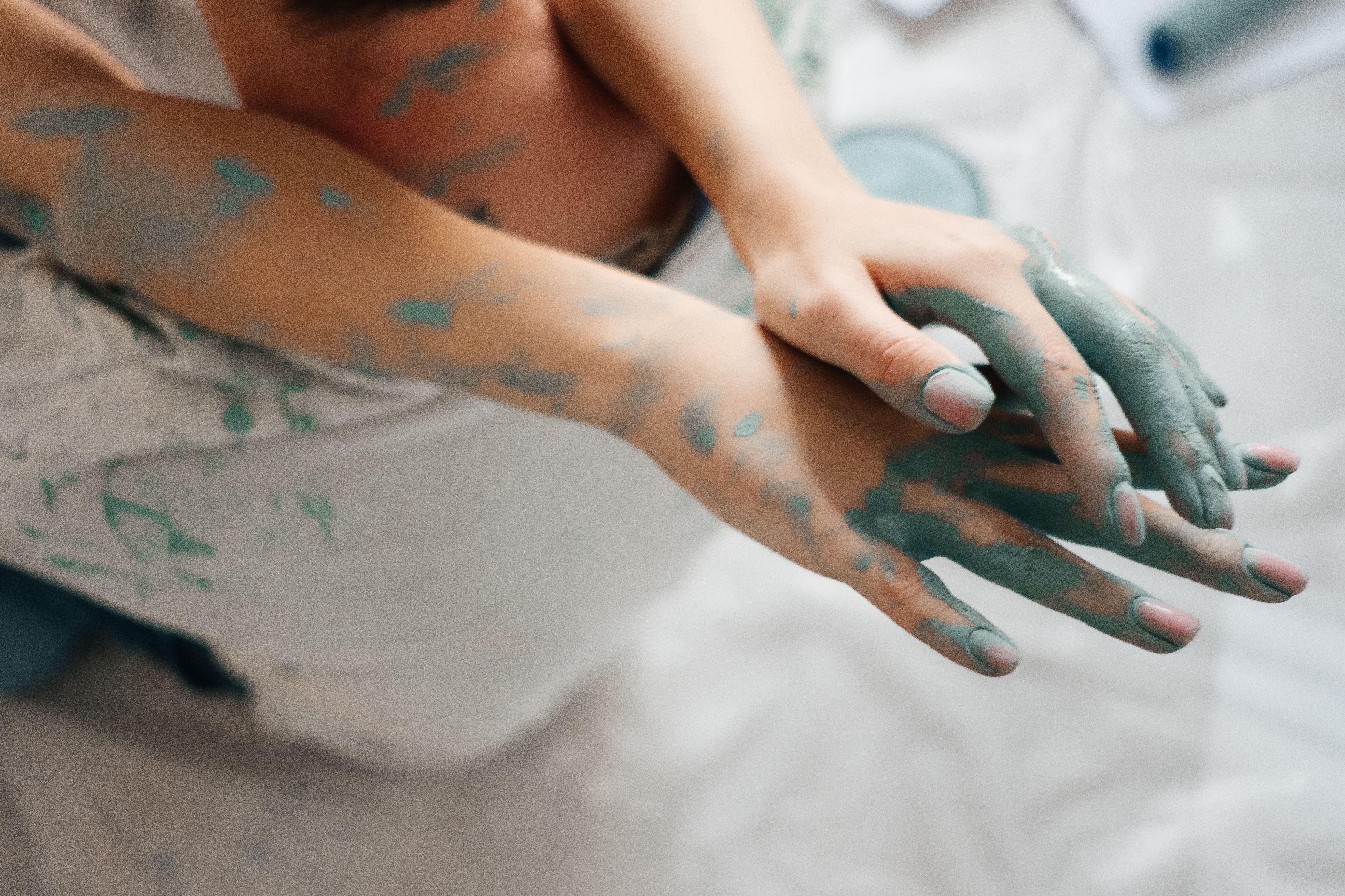 A Person's Hand with Green Paint · Free Stock Photo
