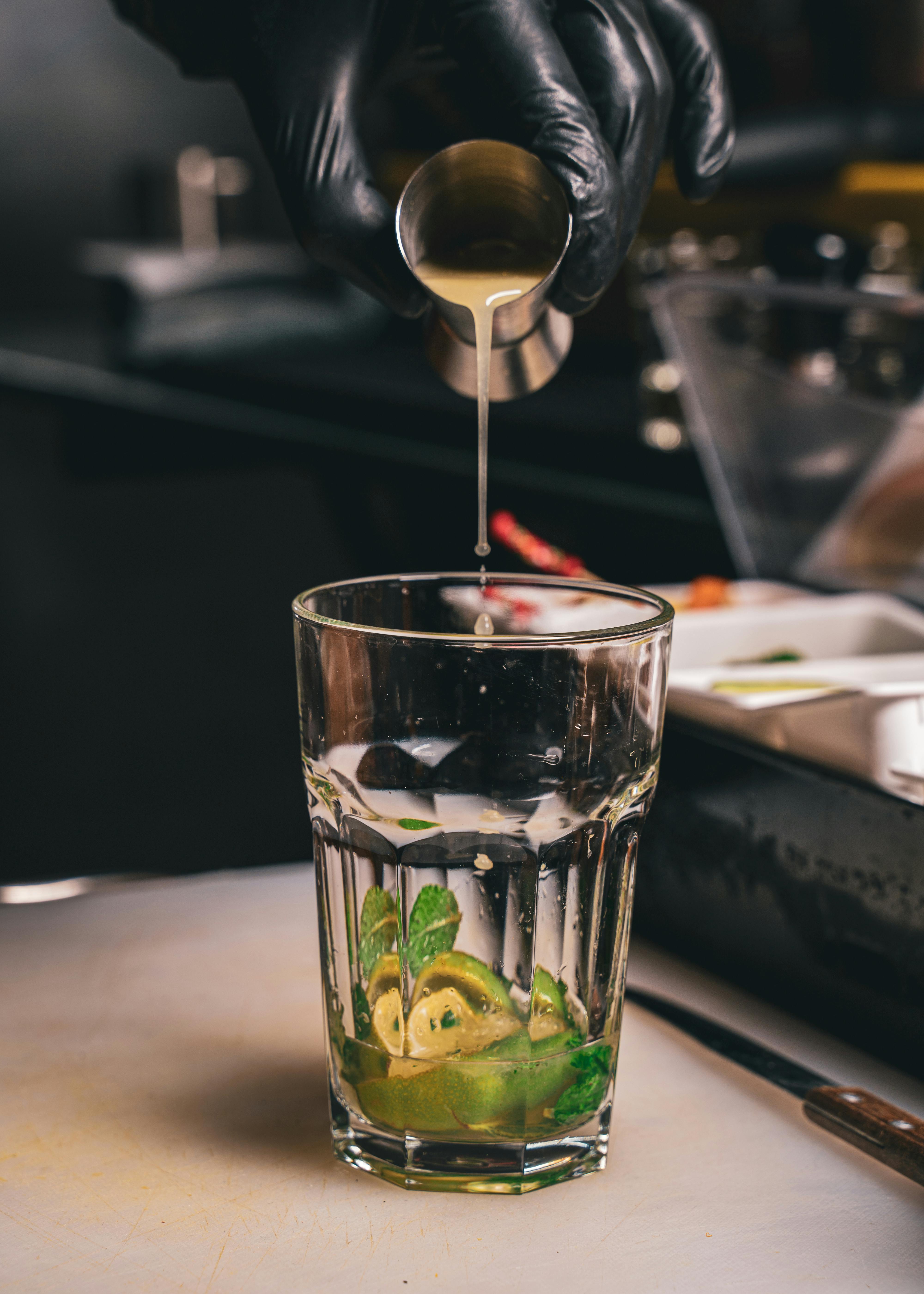 A person Holding a Jigger · Free Stock Photo