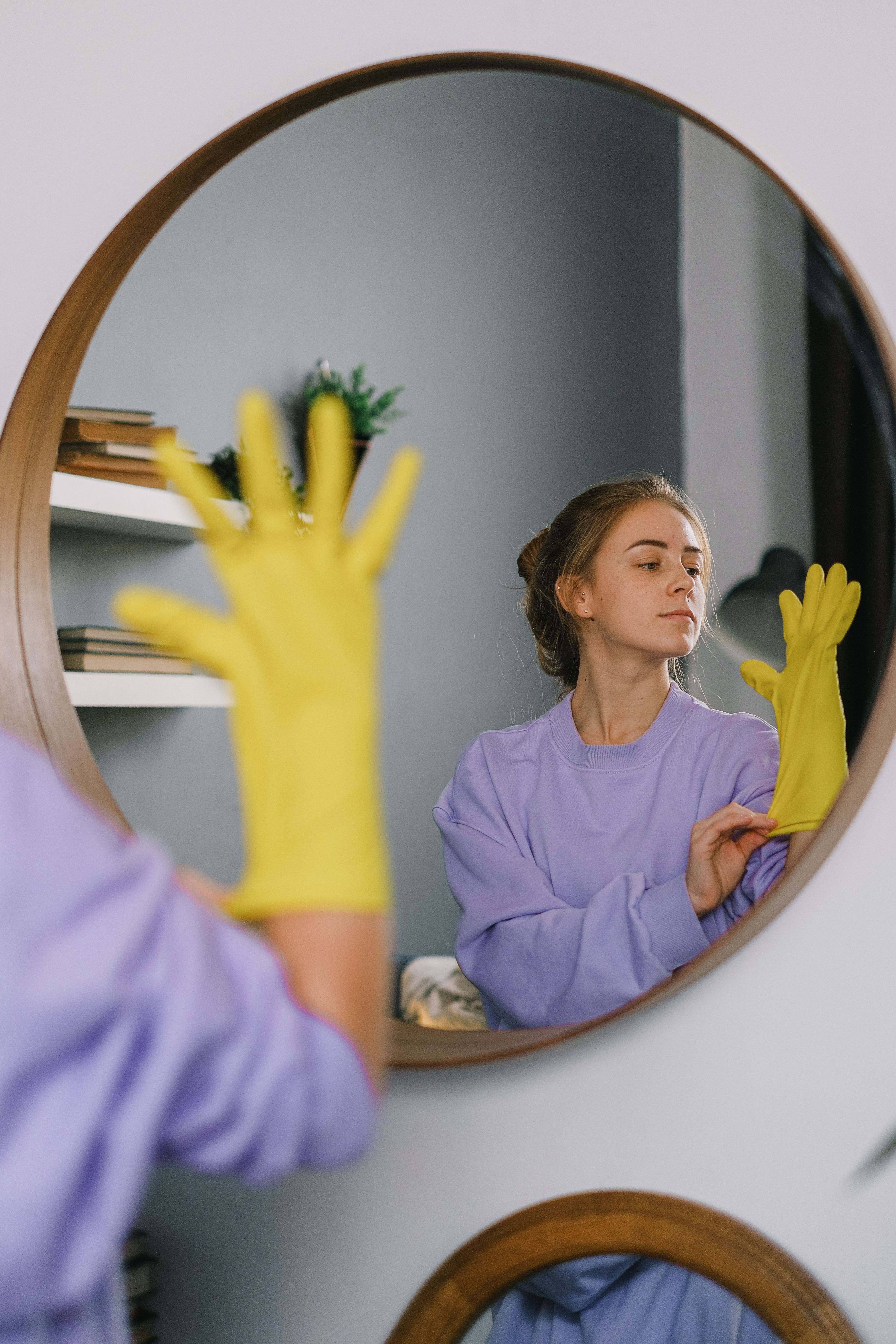 Woman's Reflection on a Wall Mirror · Free Stock Photo