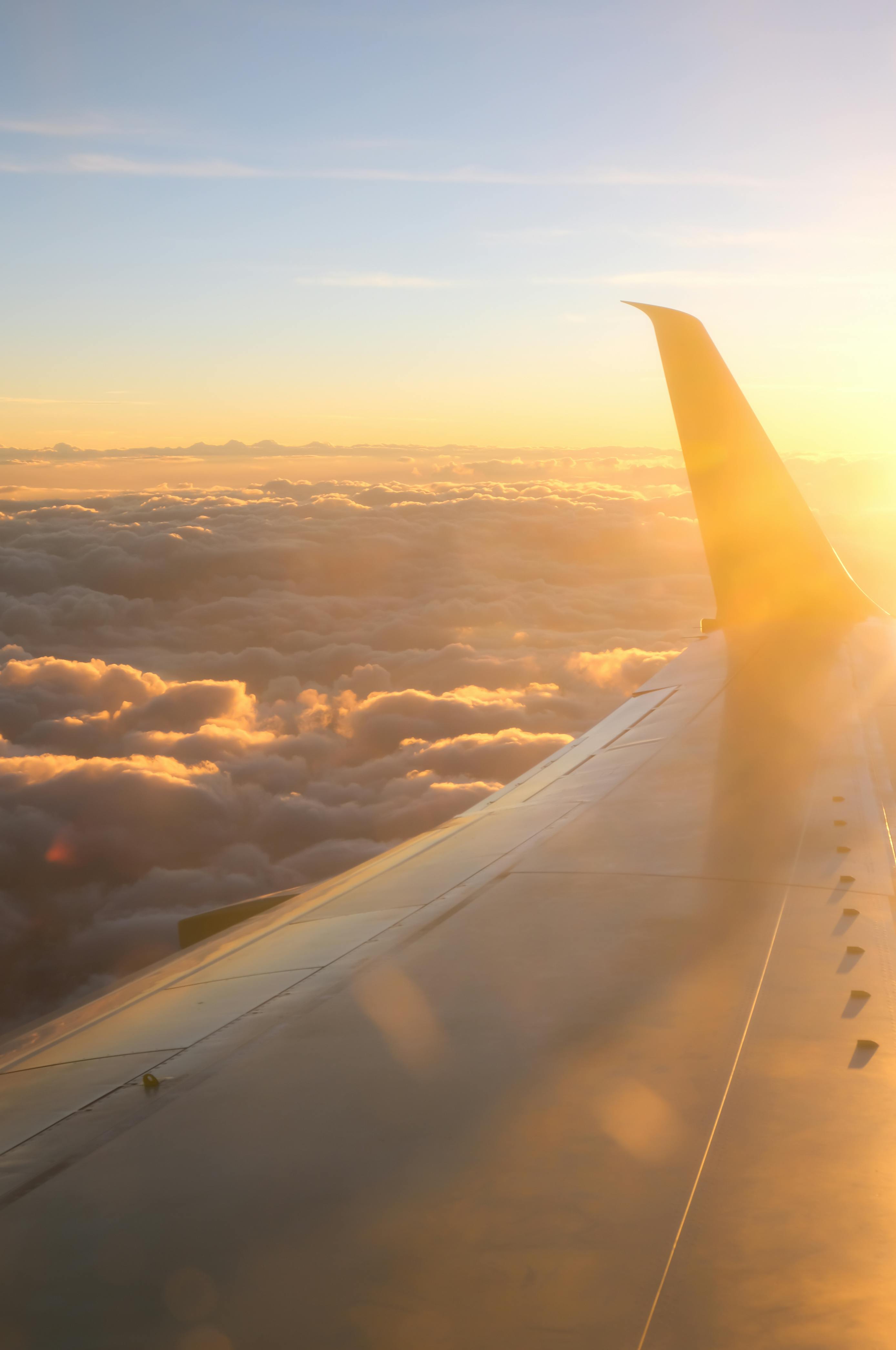 An Airplane Wing during Sunset · Free Stock Photo