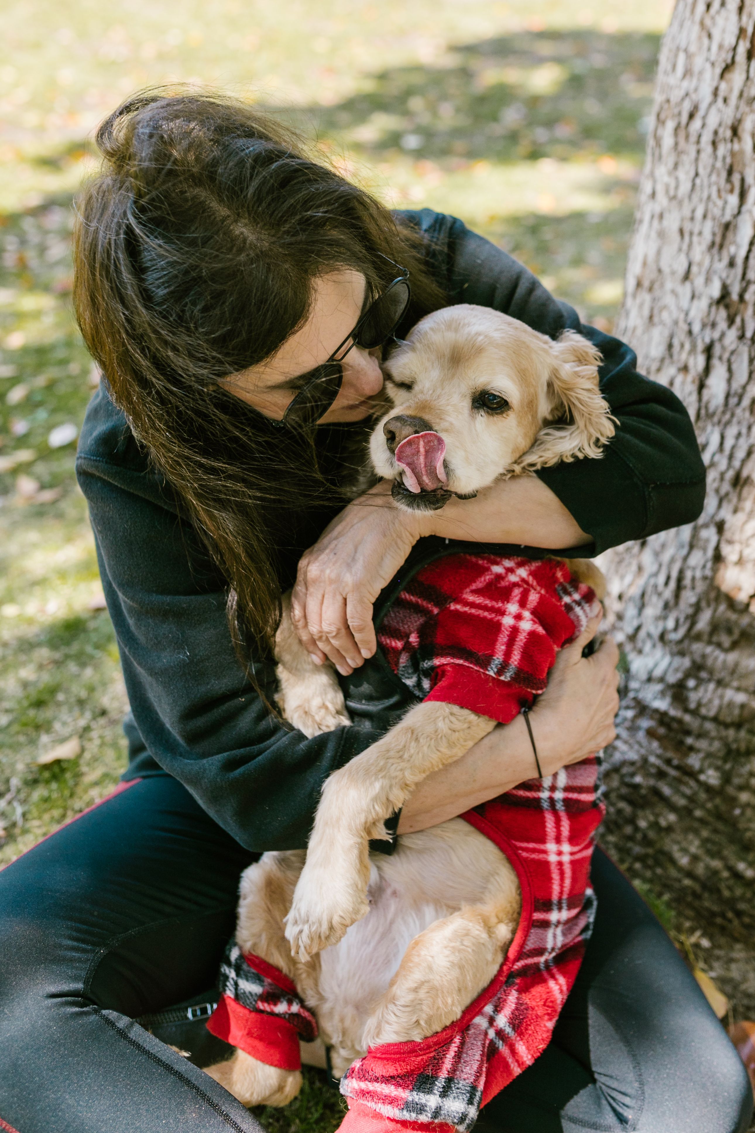 Photo of a Woman in a Beige Shirt Scared of a Dog · Free Stock Photo