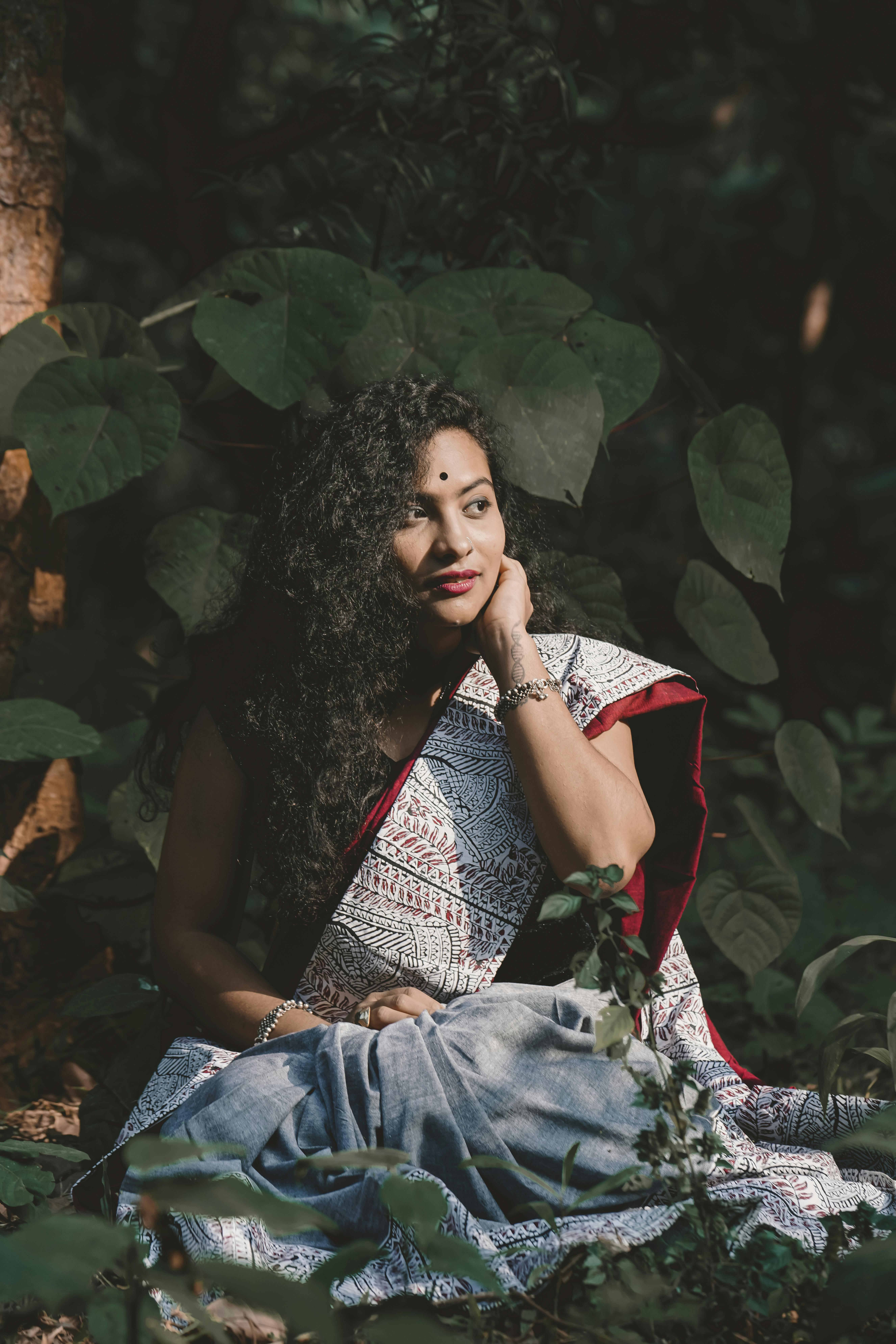 A Woman in a Saree Sitting on the Ground · Free Stock Photo