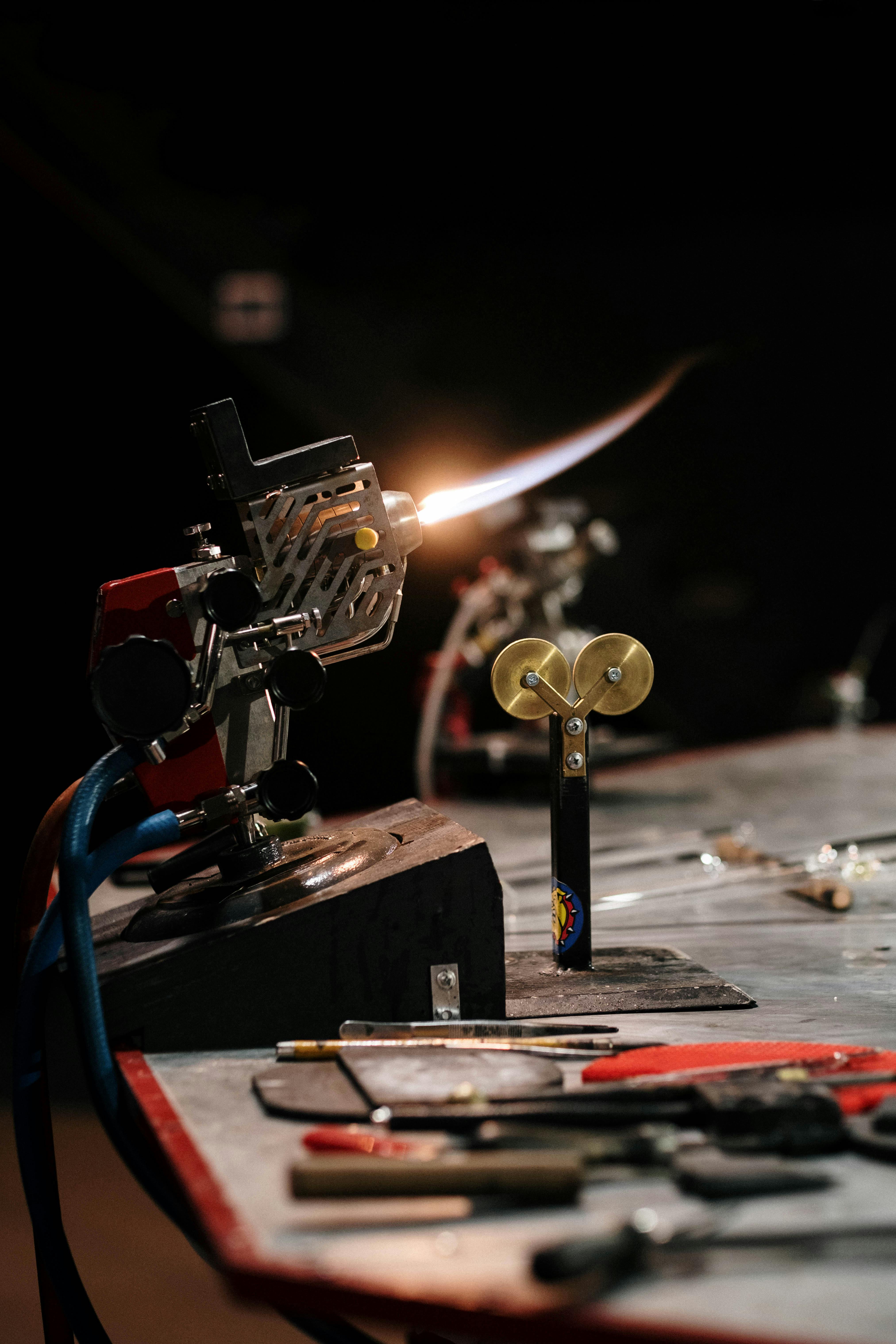 Man Heating a Glass Item with a Torch · Free Stock Photo