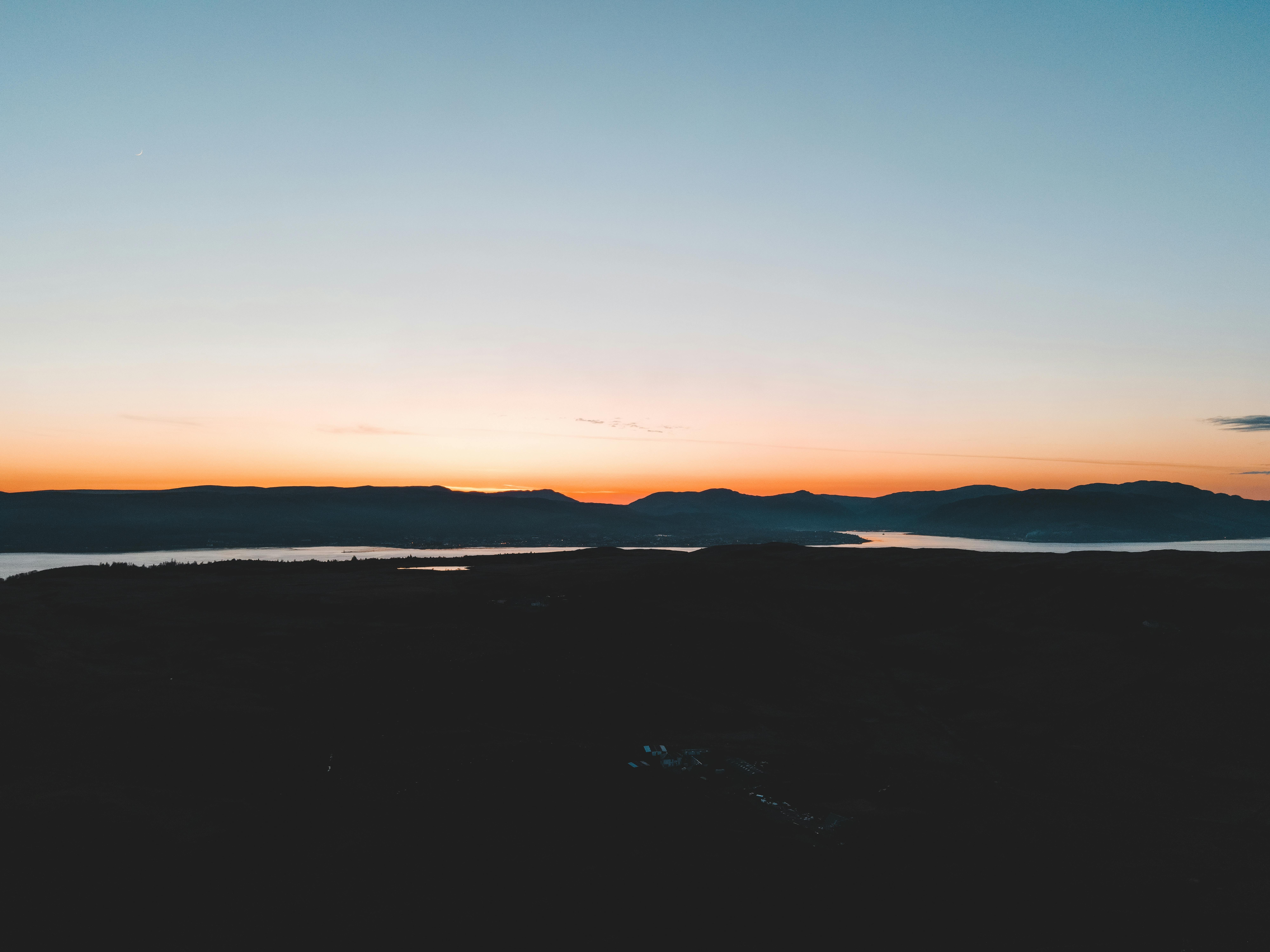 Sunset Sky Over Mountains in Distance · Free Stock Photo
