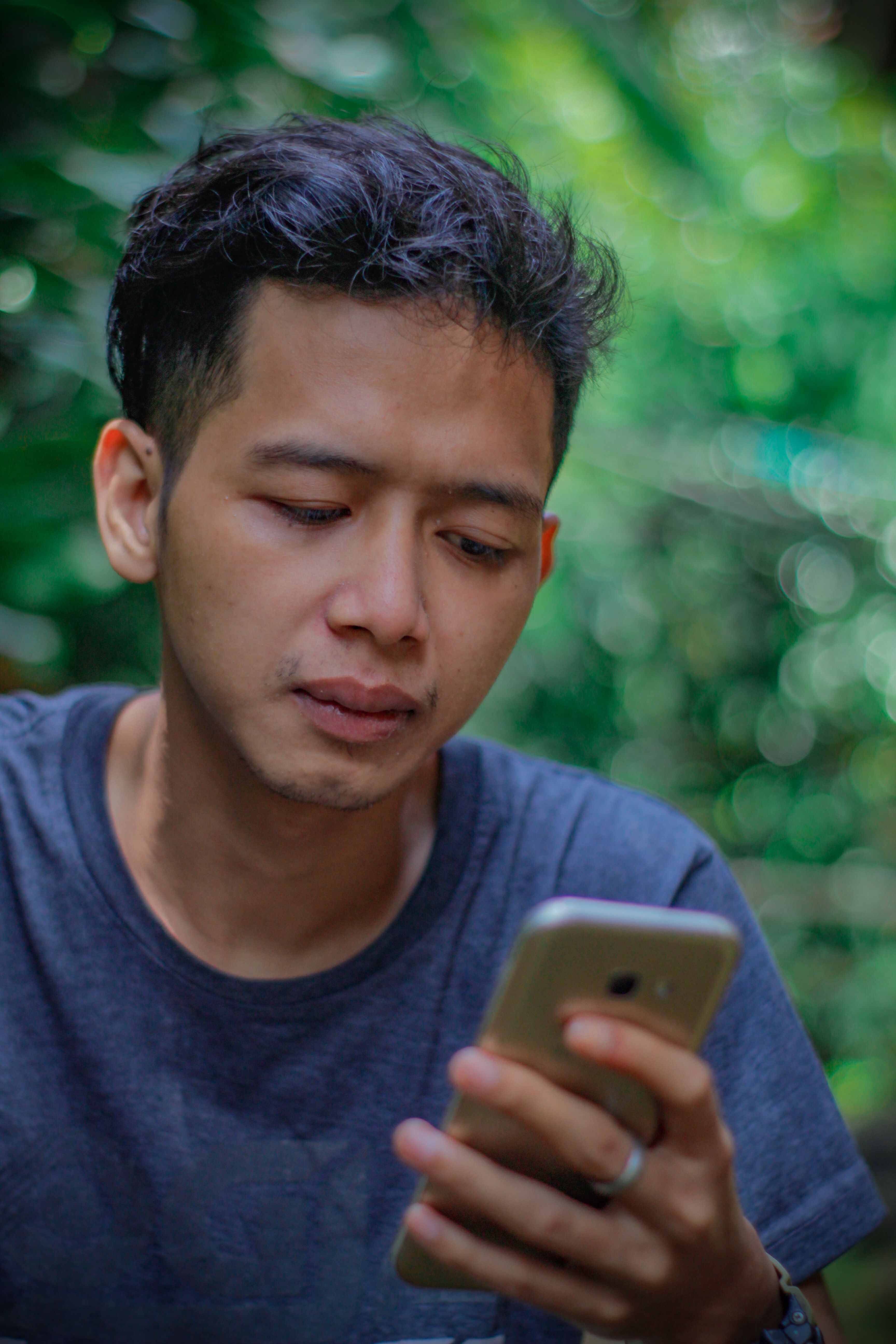 Person Holding Black Phone with Red String · Free Stock Photo