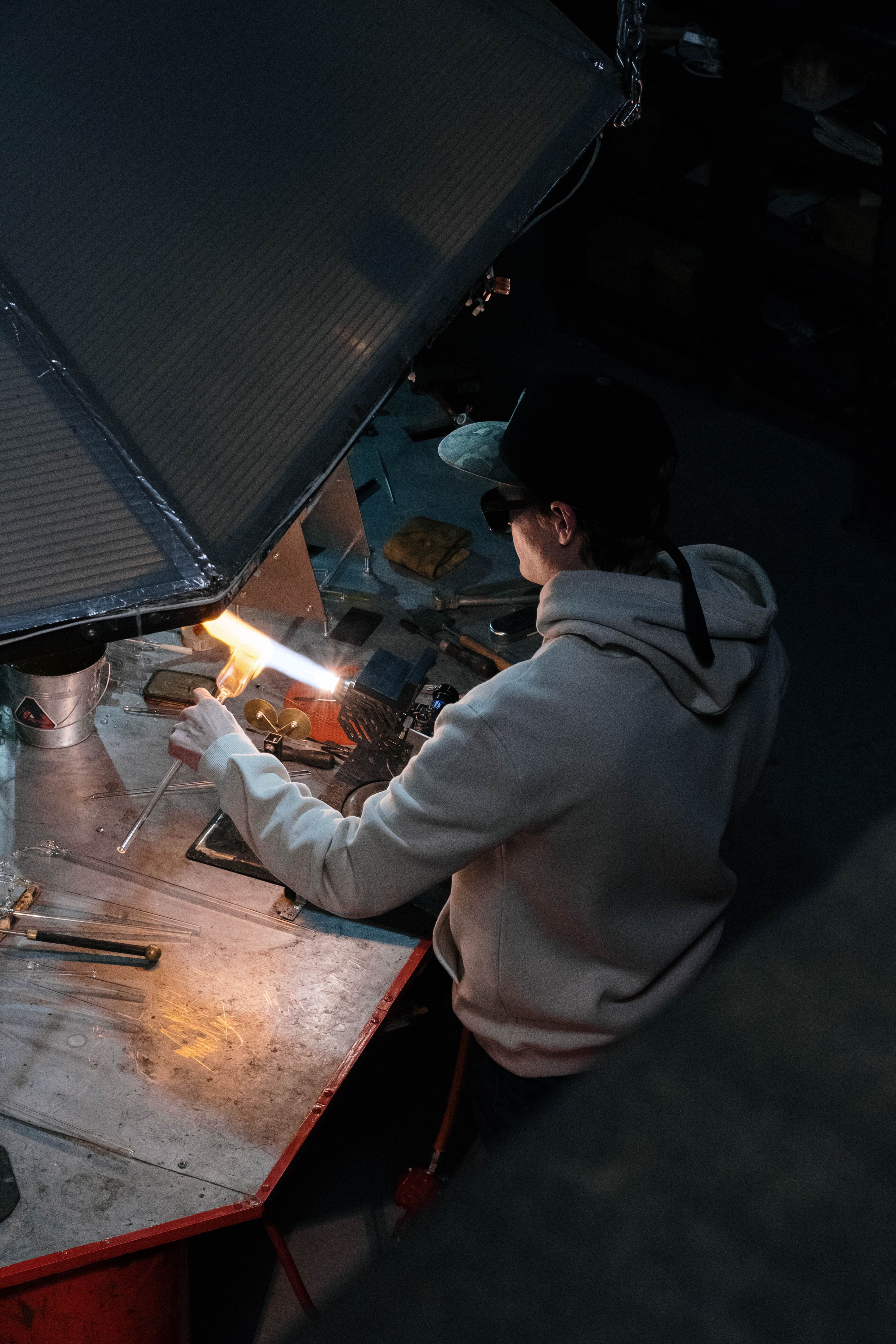 High Angle View of a Man with a Blowtorch · Free Stock Photo
