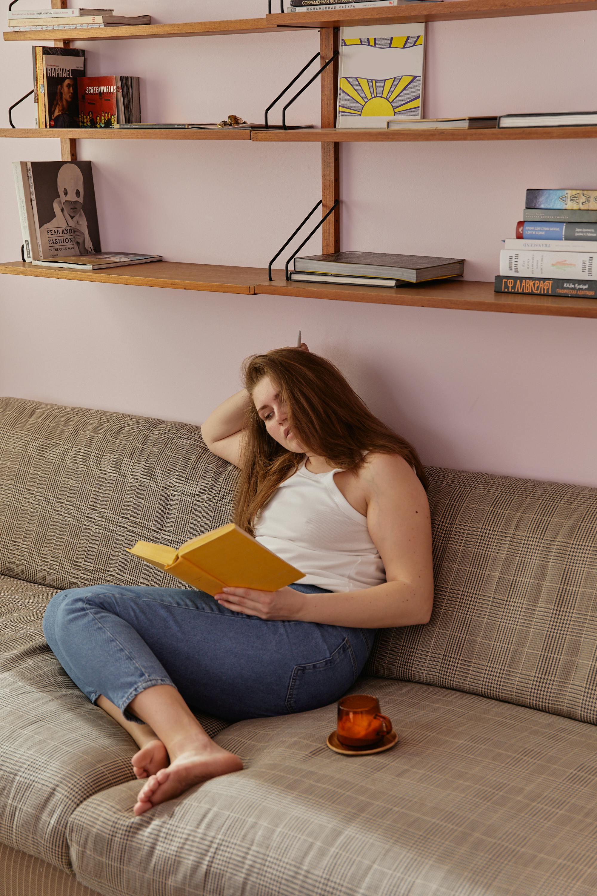 Close-Up Shot of a Woman Reading a Notebook · Free Stock Photo