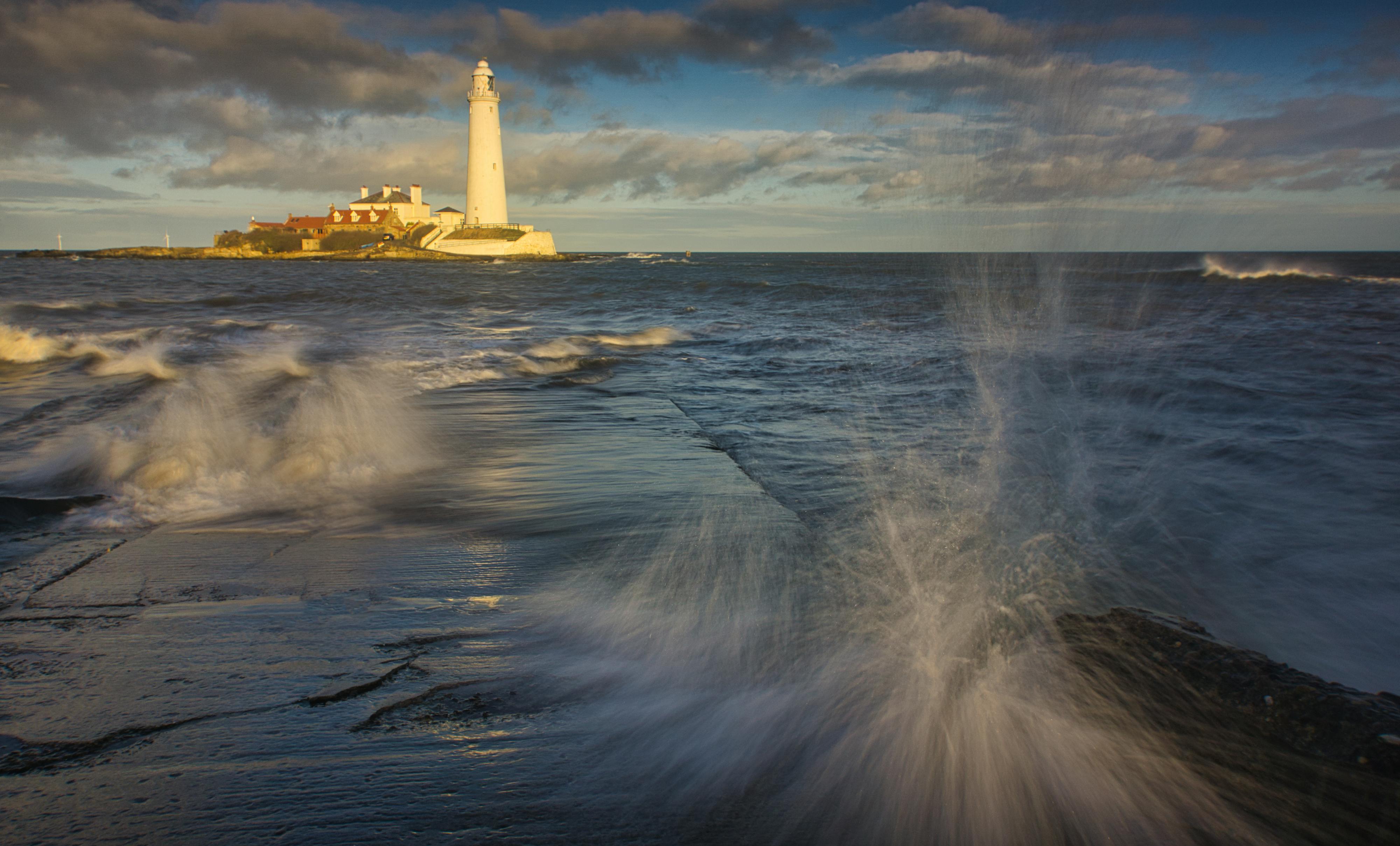 White Lighthouse on Body of Water · Free Stock Photo