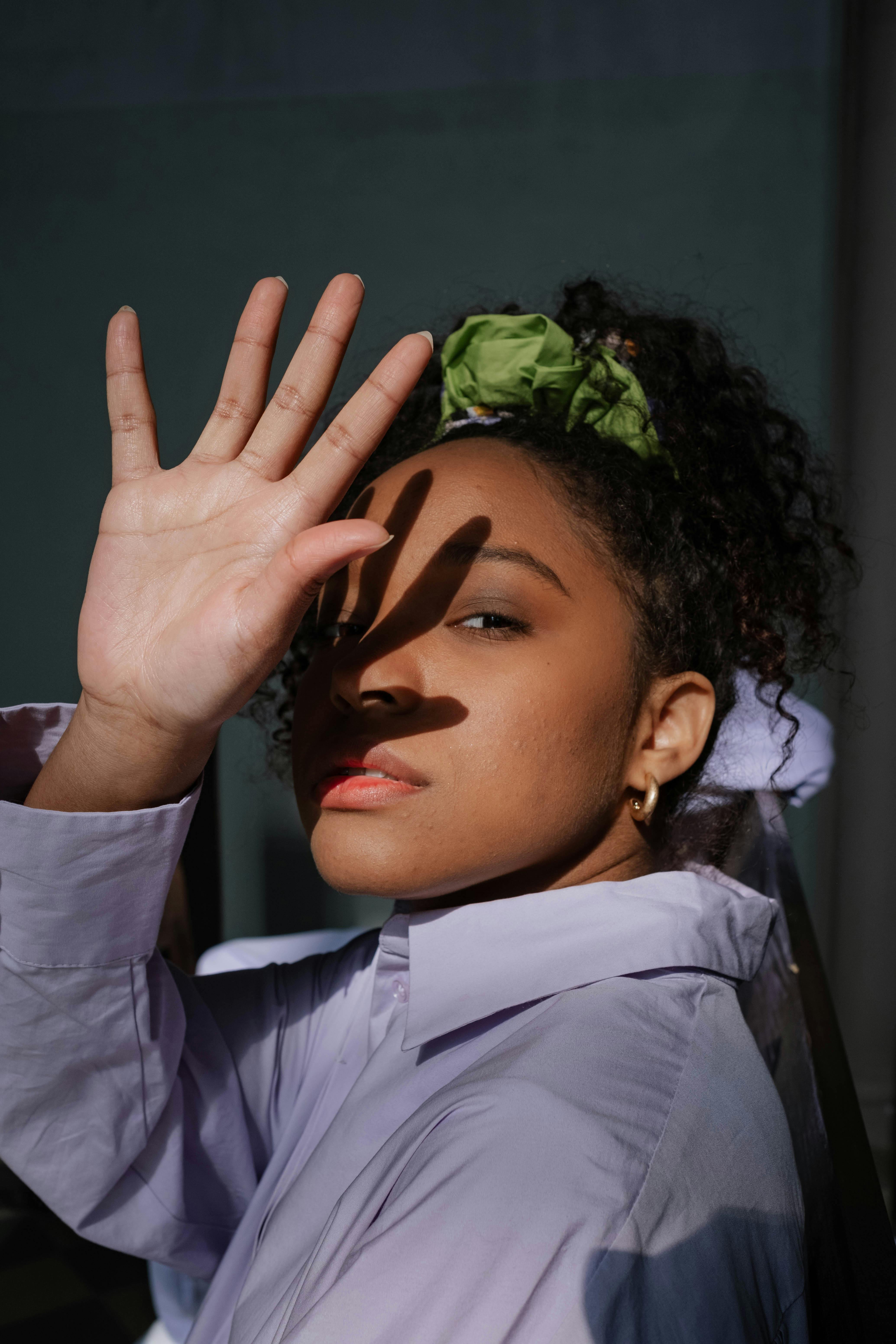 Woman Dazzled by the Sun · Free Stock Photo