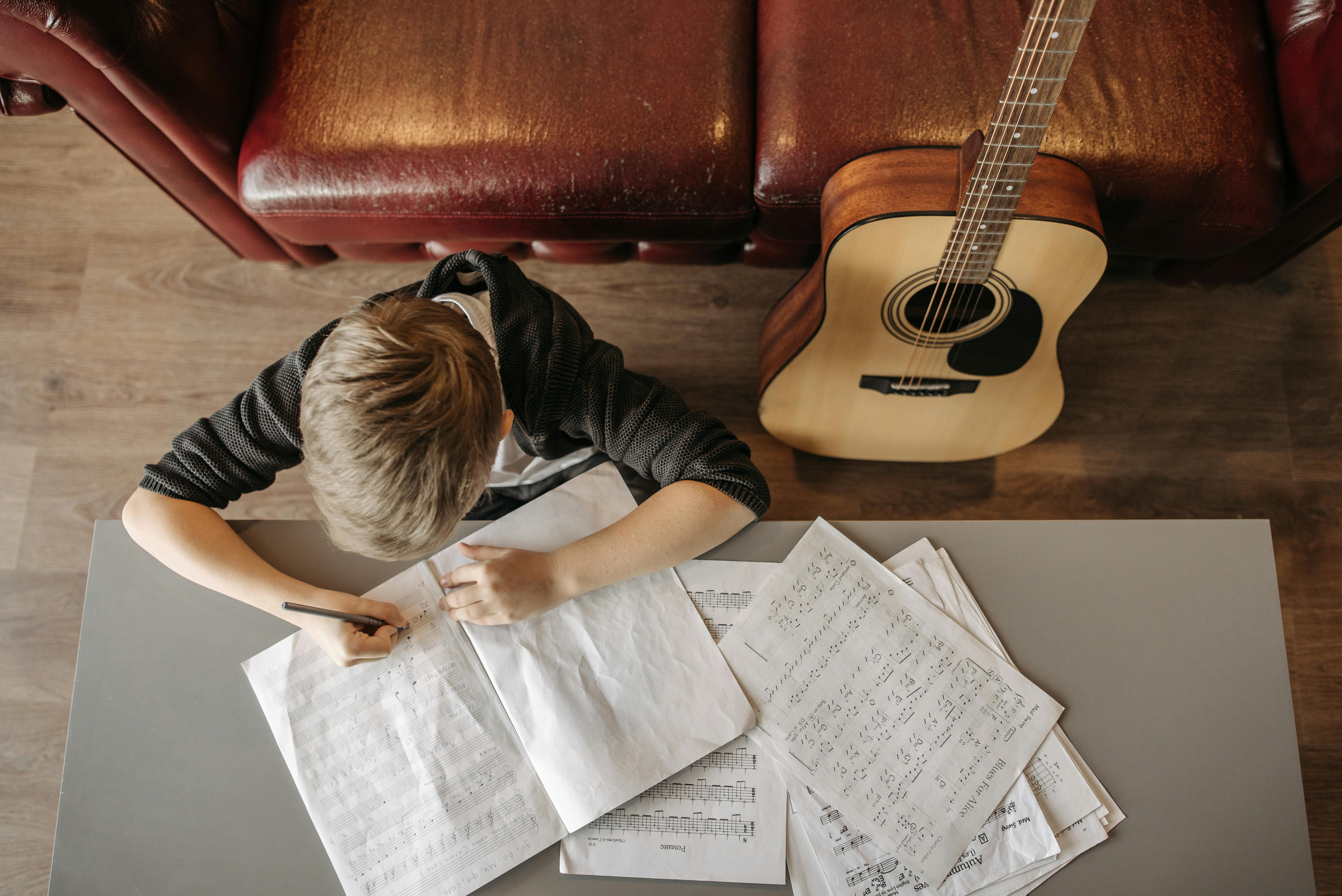 Boy Learning Musical Notes · Free Stock Photo