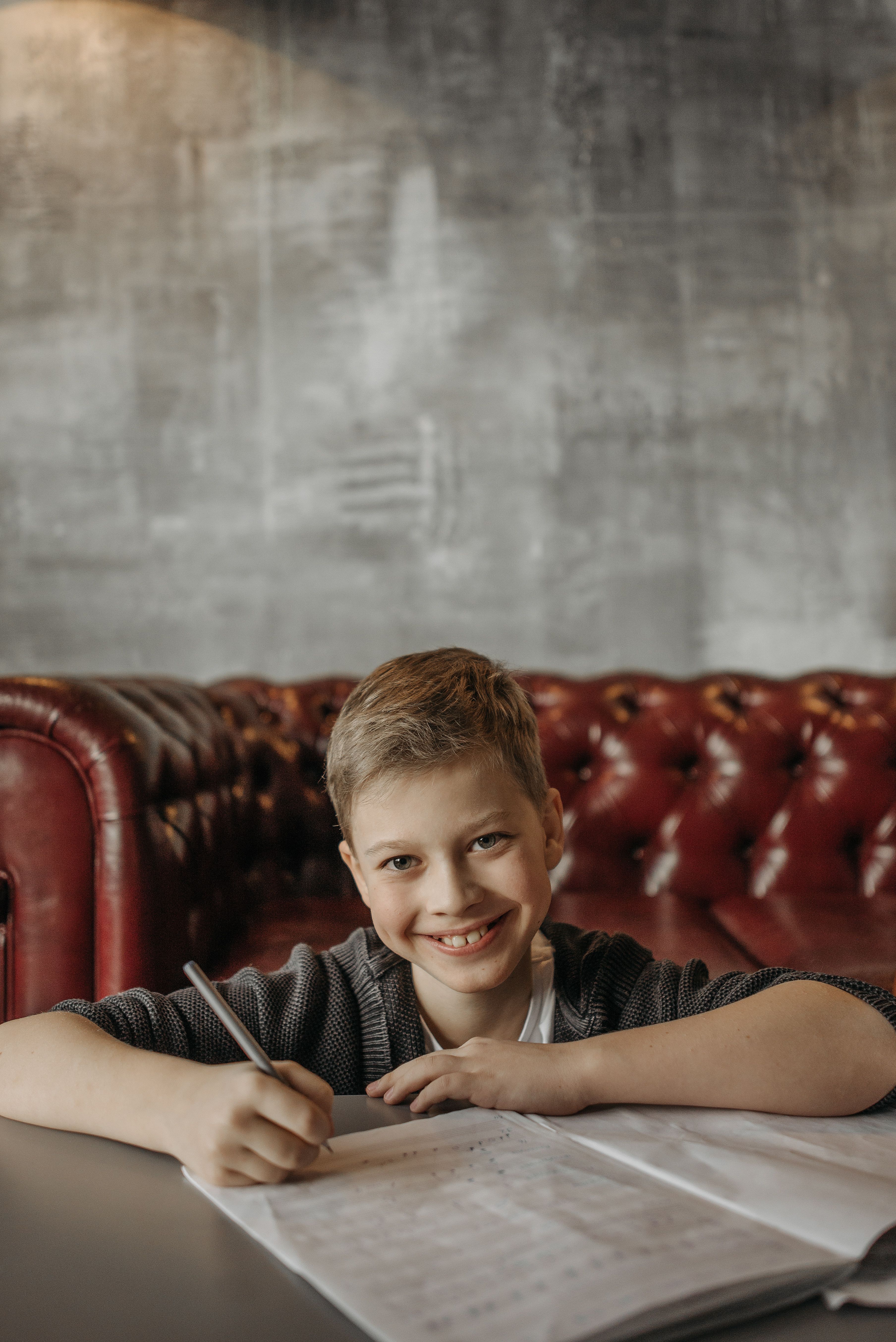 Boy Smiling and Learning Musical Notes · Free Stock Photo
