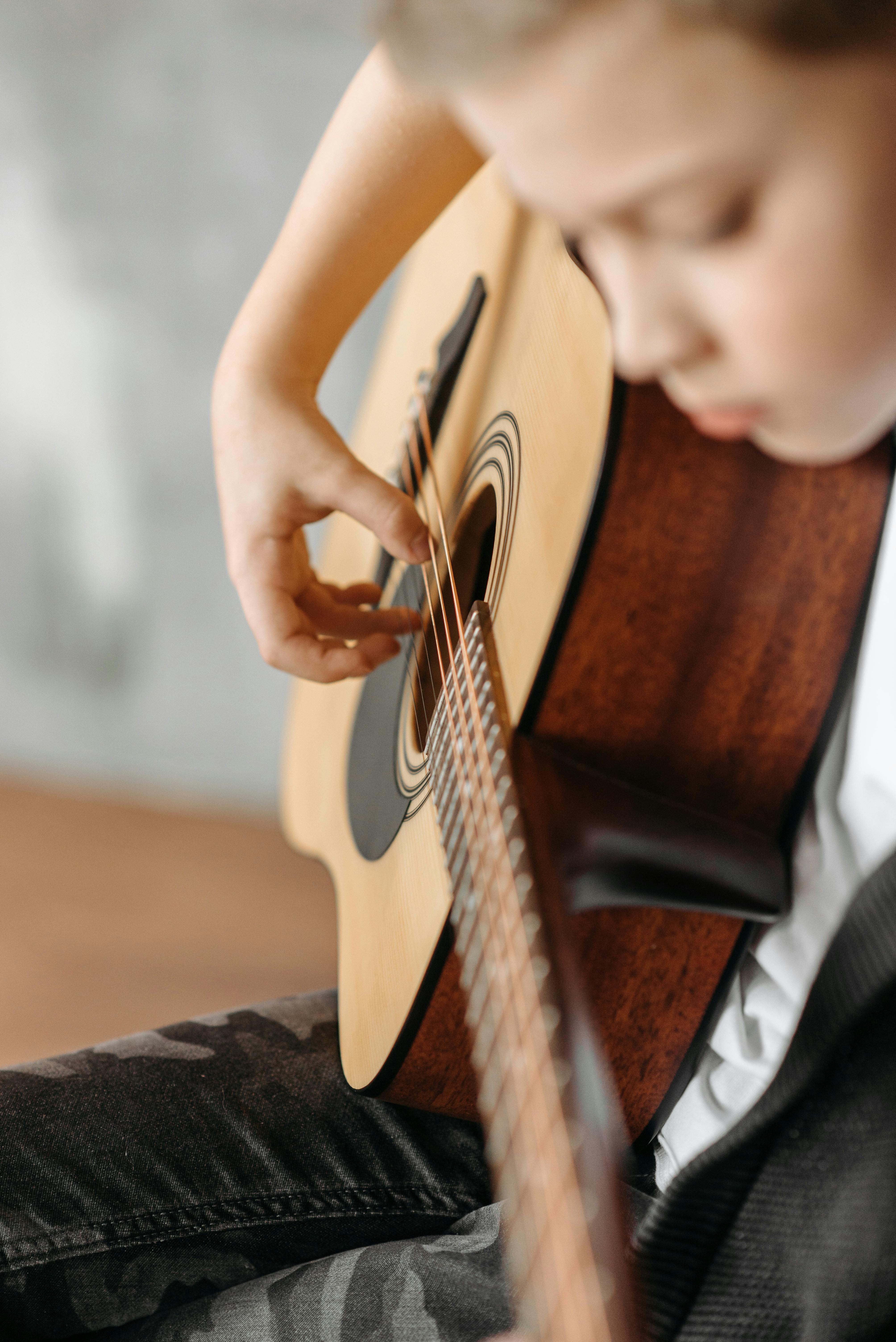 A Boy Playing Guitar · Free Stock Photo