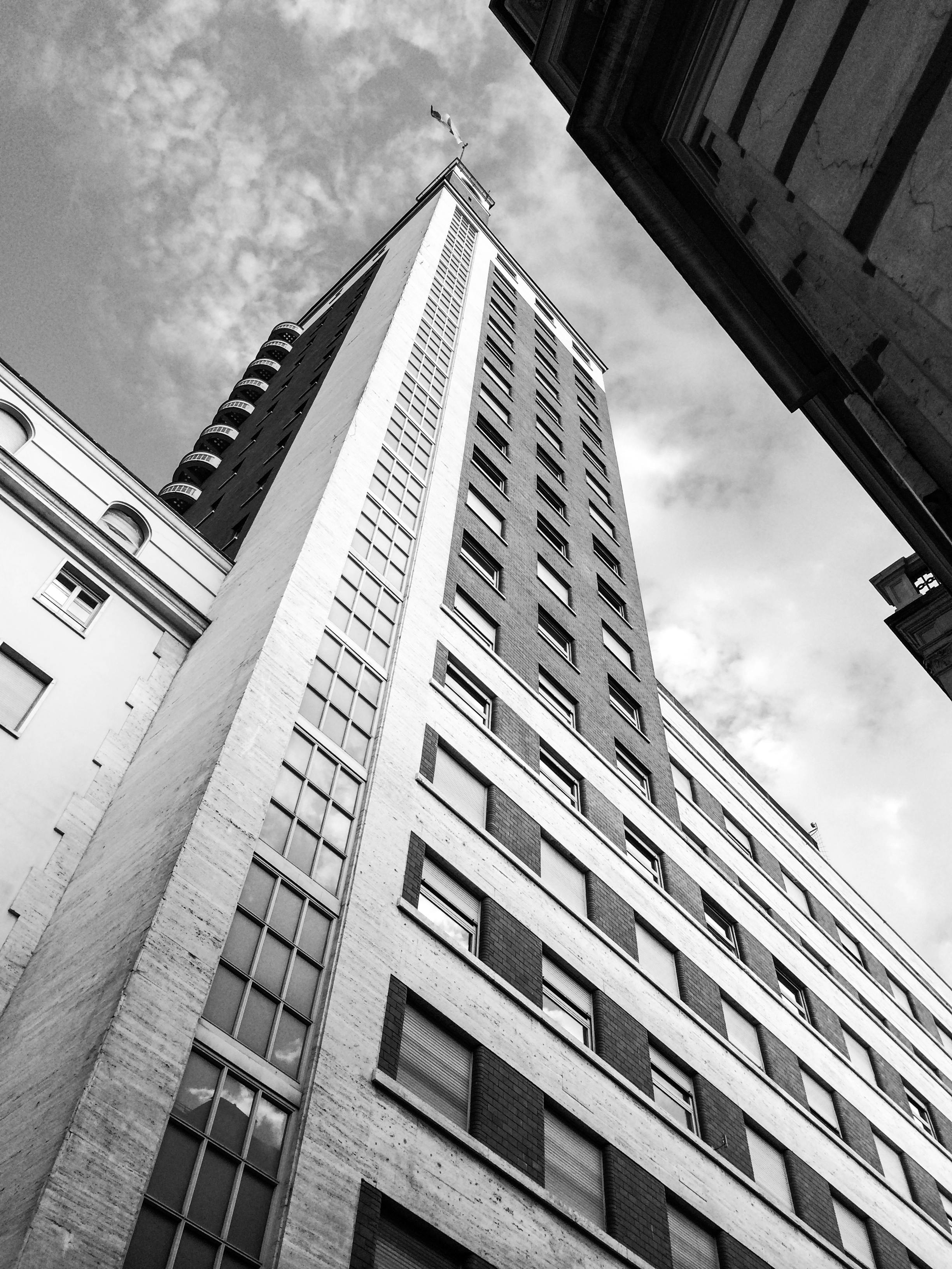 Grayscale Photo of High Rise Building · Free Stock Photo