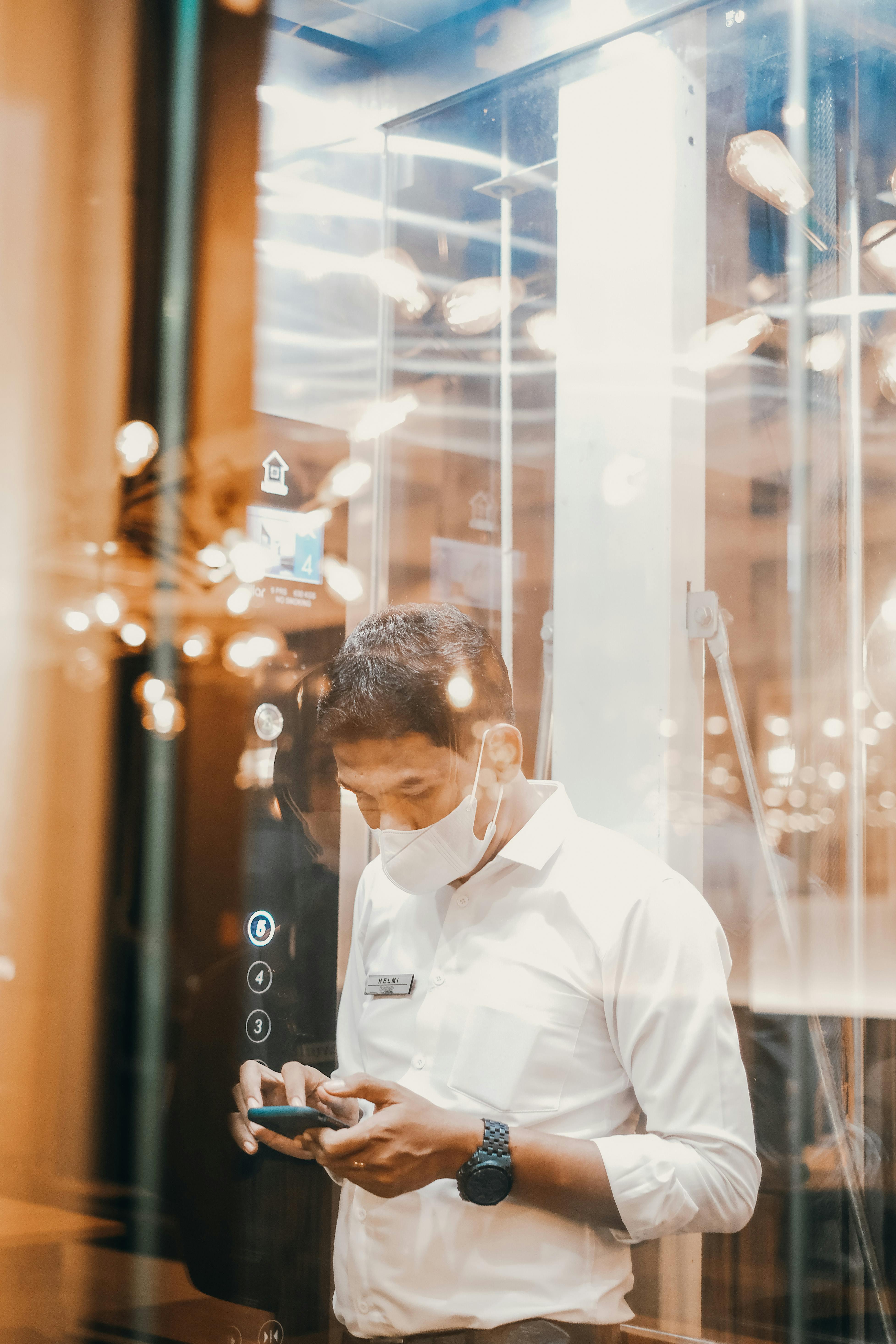 Photo of Man Using his Cellphone · Free Stock Photo