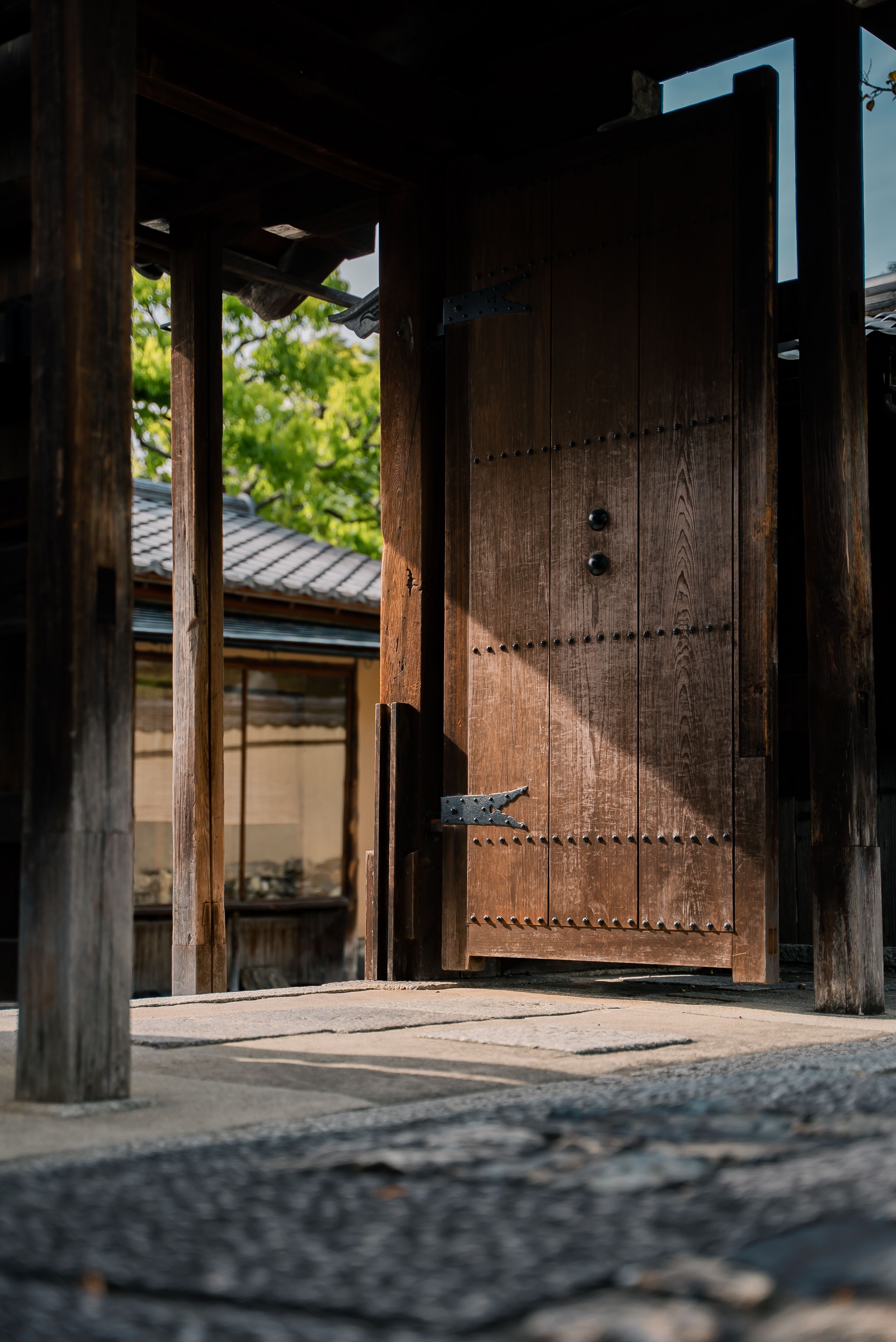 A Brown Wooden Door Propped Open · Free Stock Photo