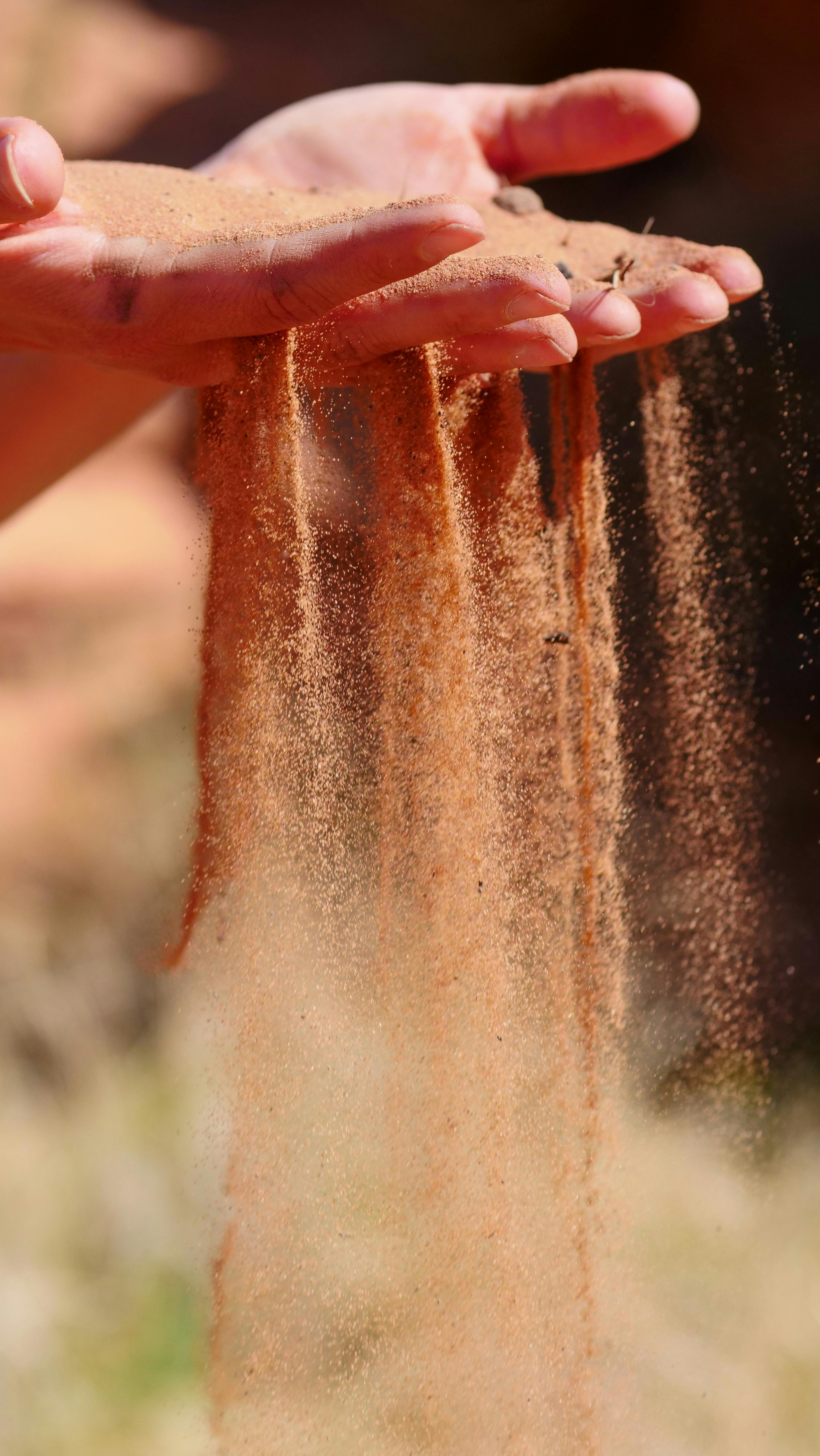Close-up Photo of a Person Playing with Sand · Free Stock Photo
