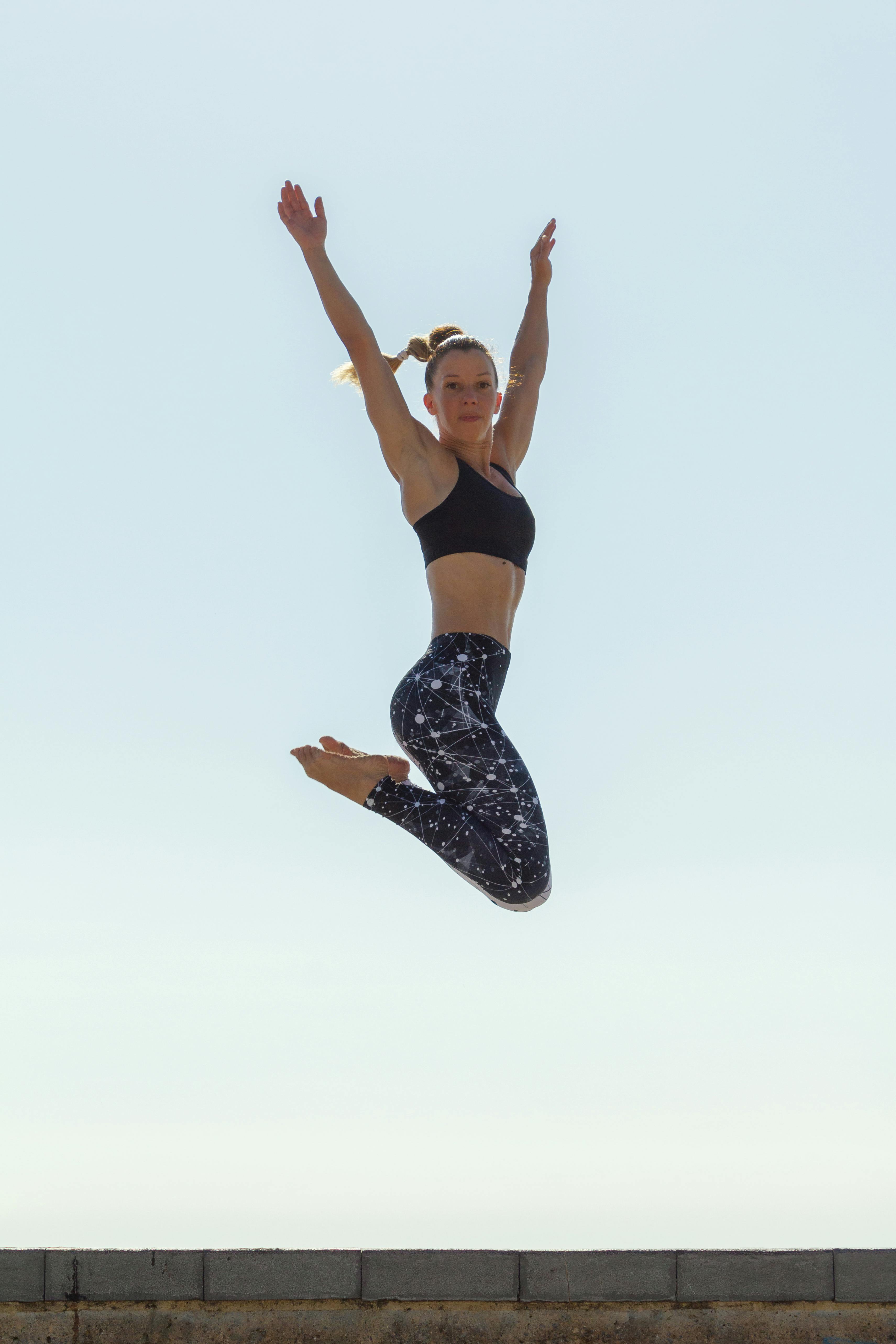 A Back View of an Athlete Stretching a Jumping Rope · Free Stock Photo