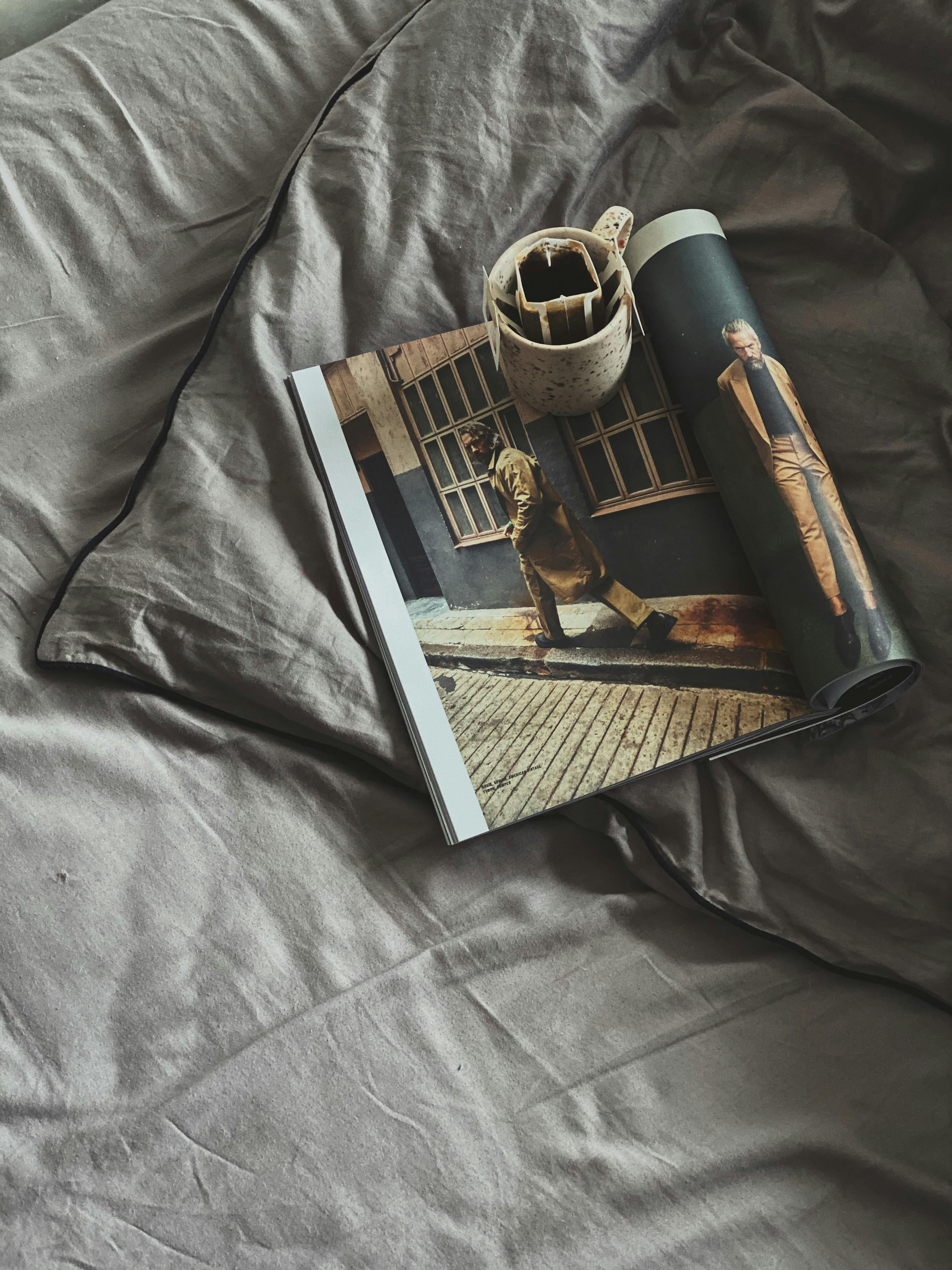 Coffee and book on comfortable bed · Free Stock Photo