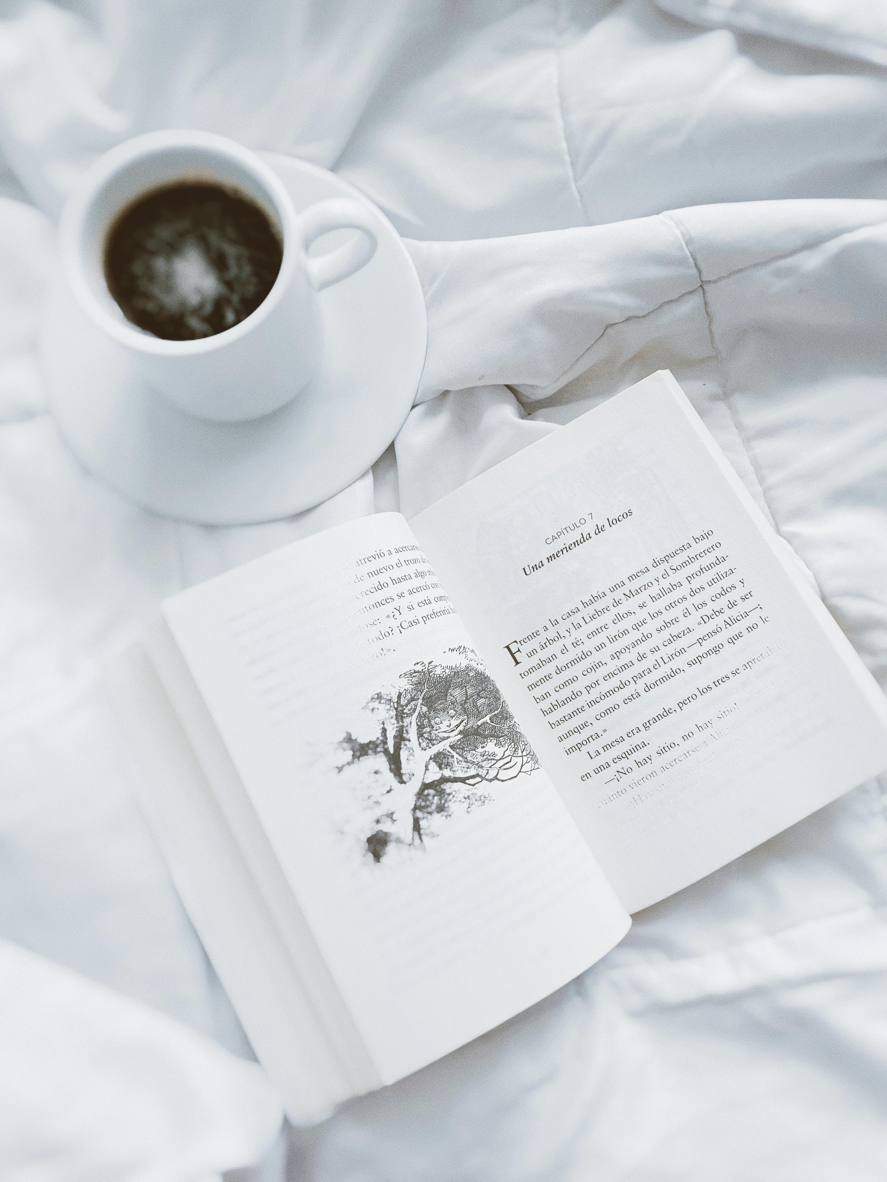 Open Book Beside a Cup of Coffee · Free Stock Photo