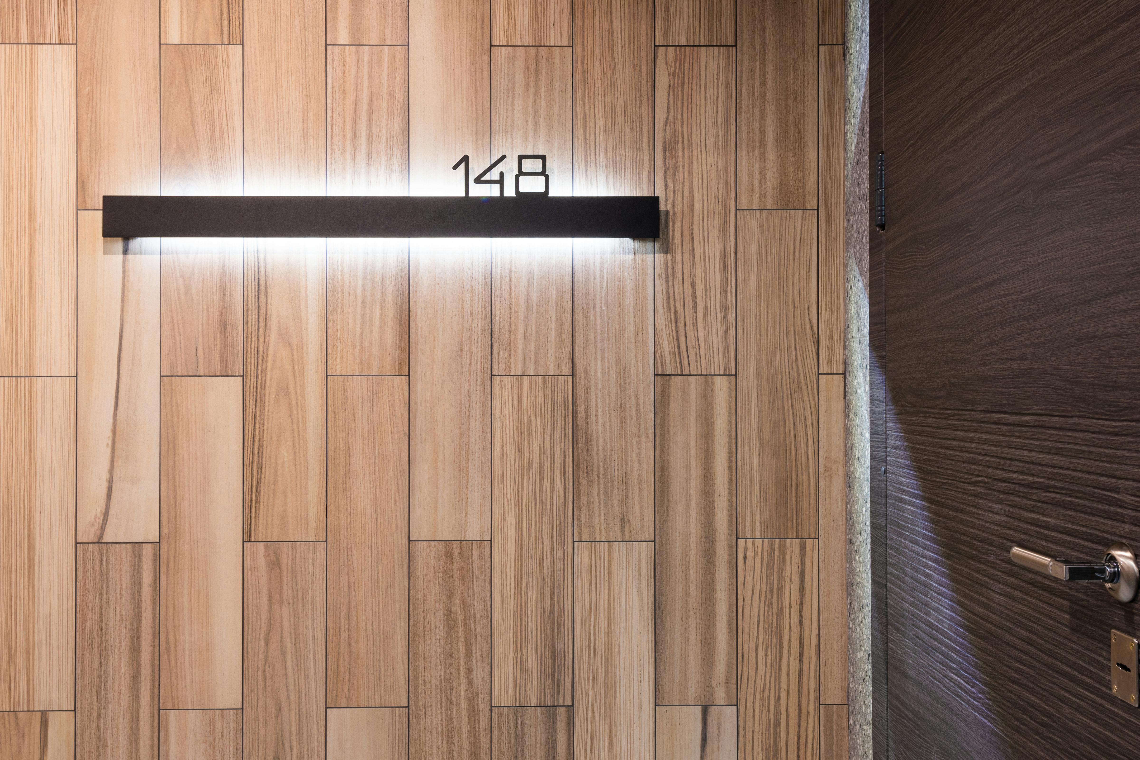 Crop person opening building door in sunlight · Free Stock Photo