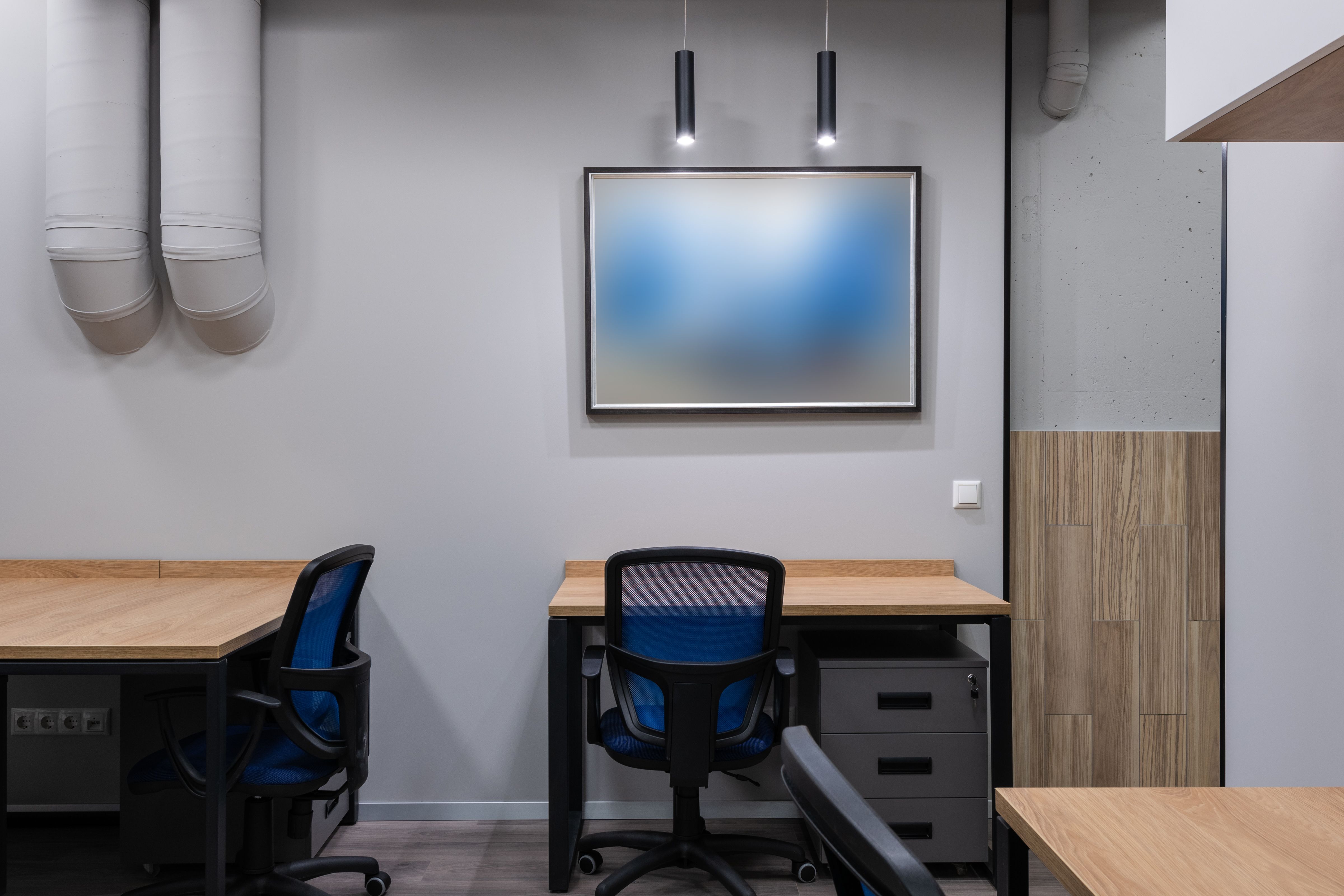 Modern convenient computer placed on table in office with curtains ...