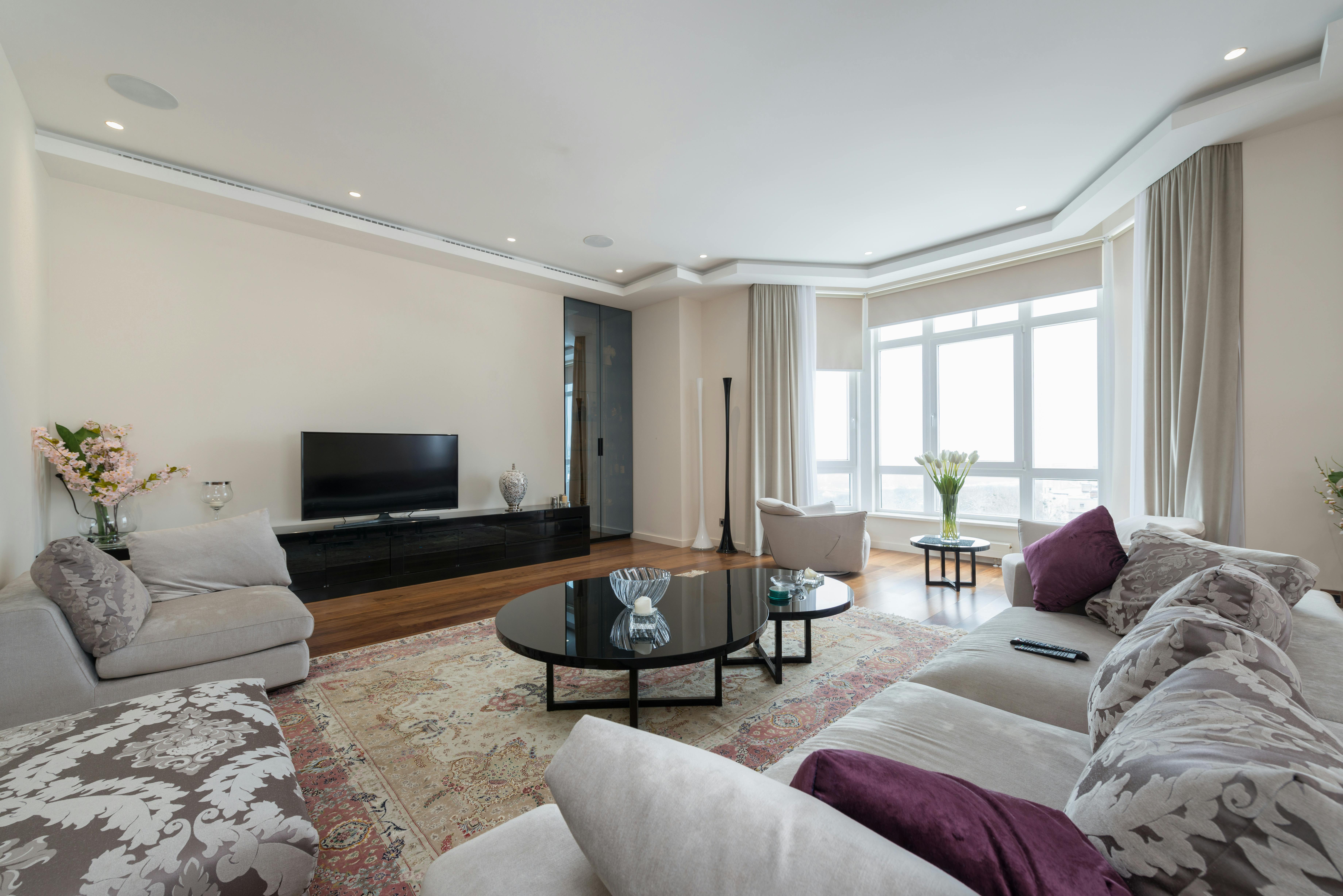 Comfortable couches and armchairs in classy living room · Free Stock Photo