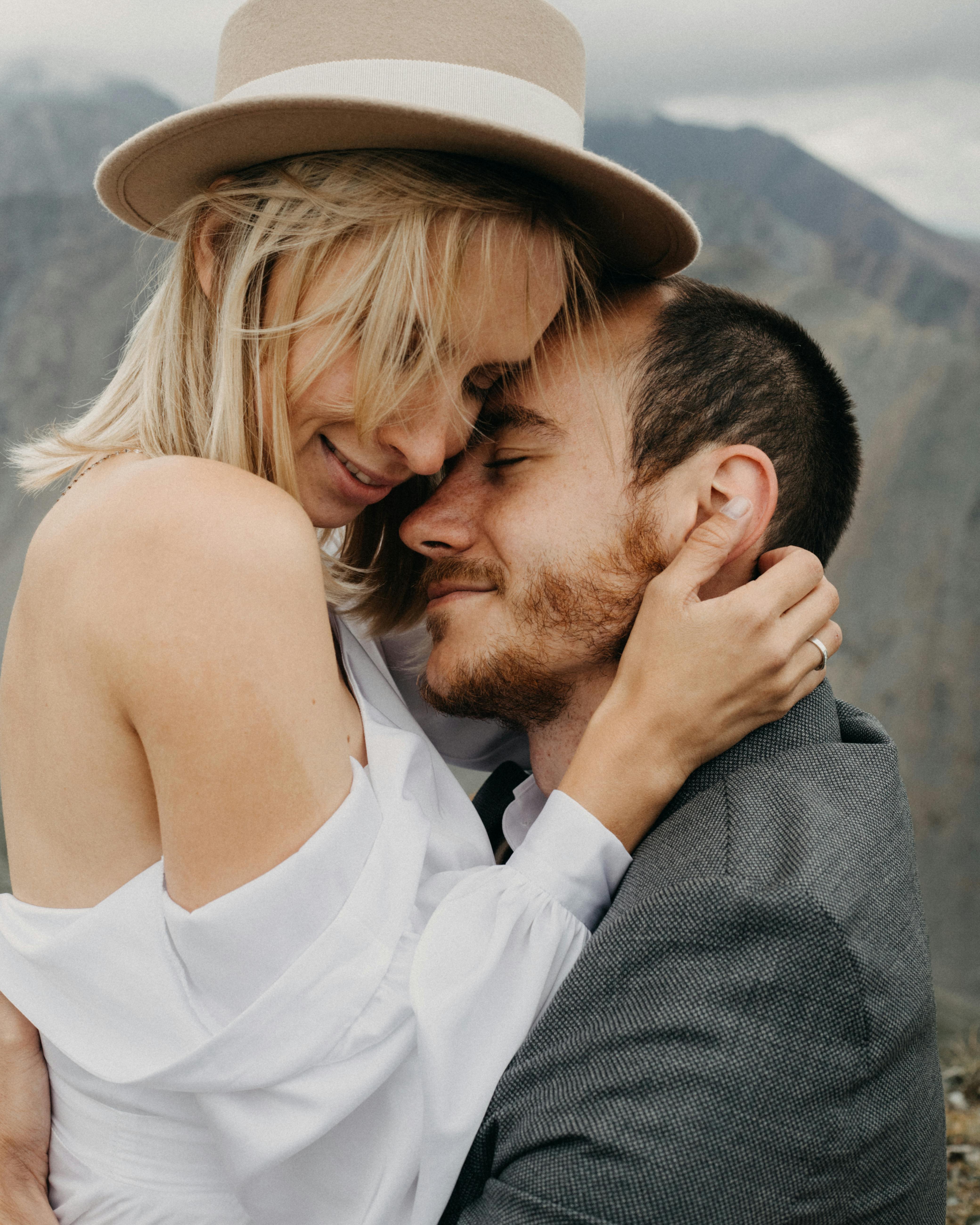 Romantic couple hugging in field in nature under cloudless sky · Free ...
