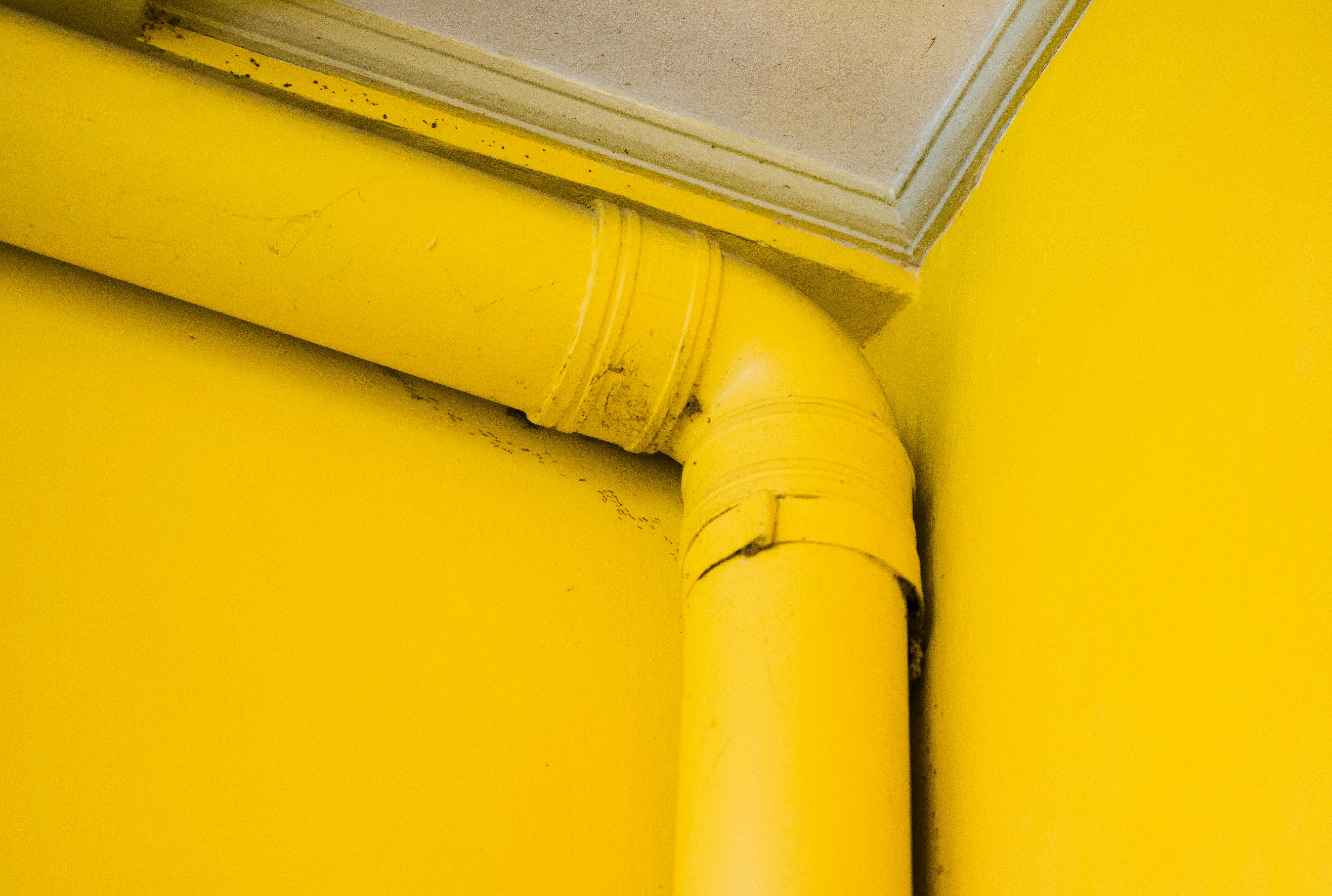 A Close-Up Shot of a Yellow Pipe · Free Stock Photo