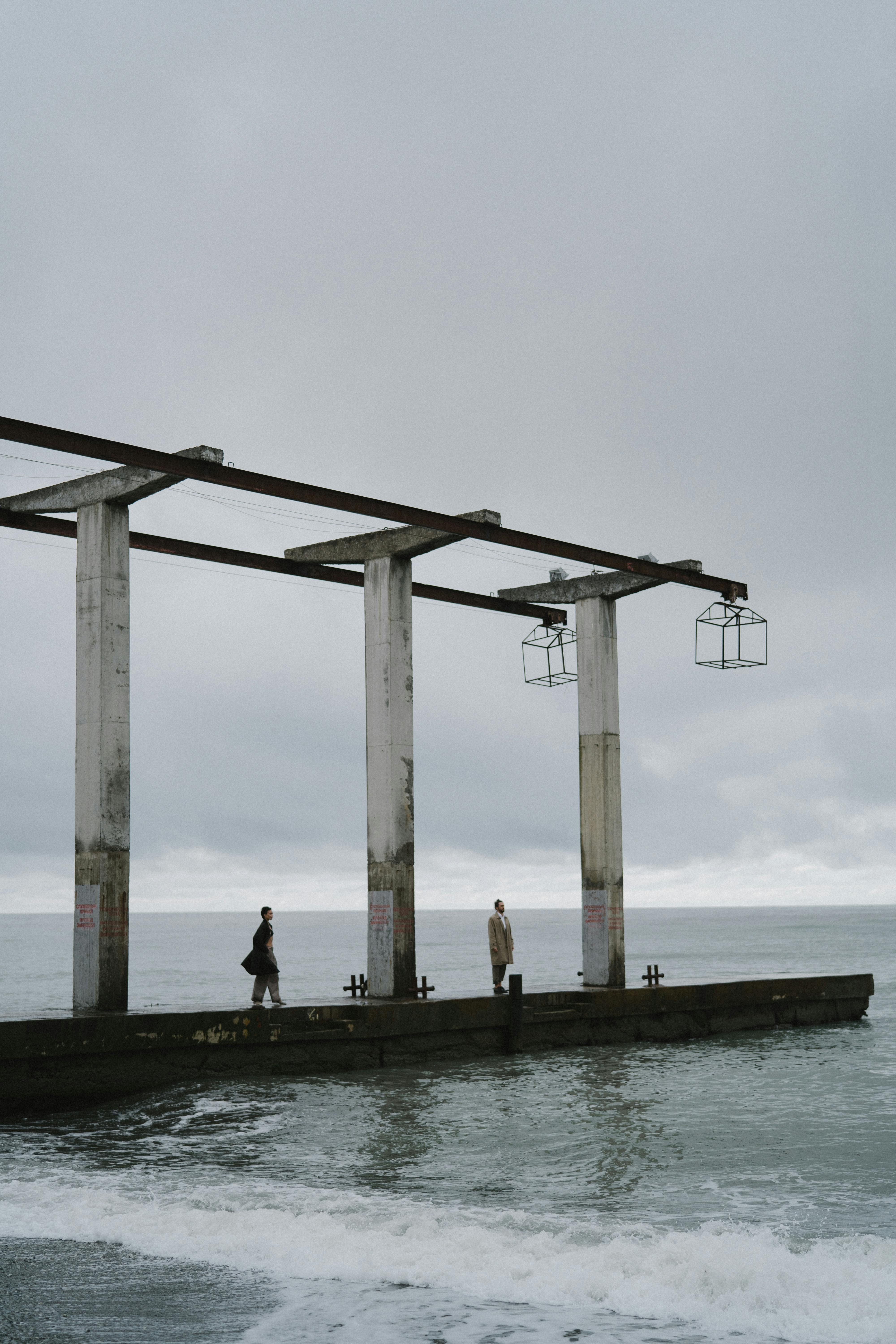 People Standing on Dock Near Body of Water · Free Stock Photo