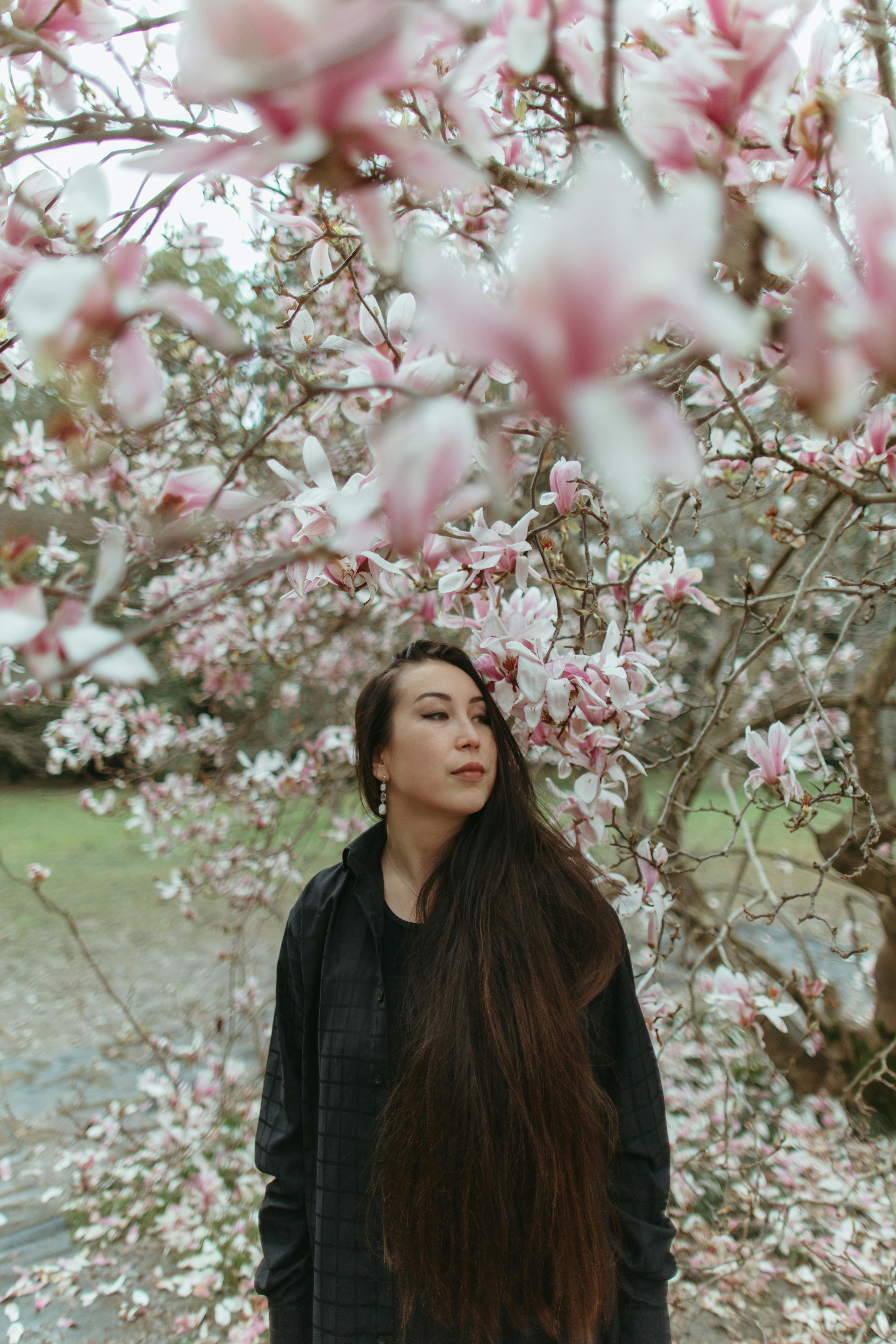 Woman Standing Beside a Tree · Free Stock Photo