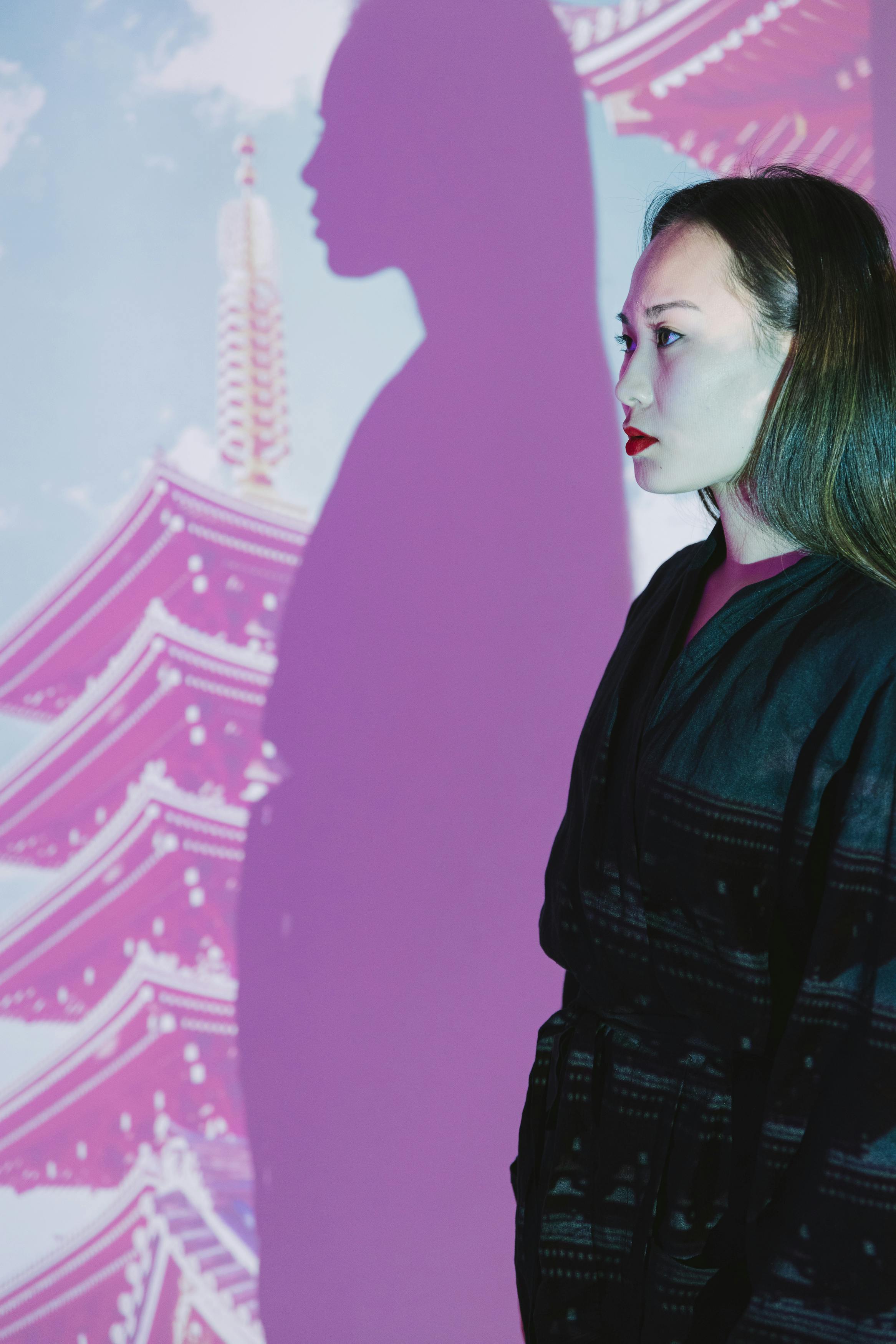 Woman with Projector Beams on Her Face · Free Stock Photo