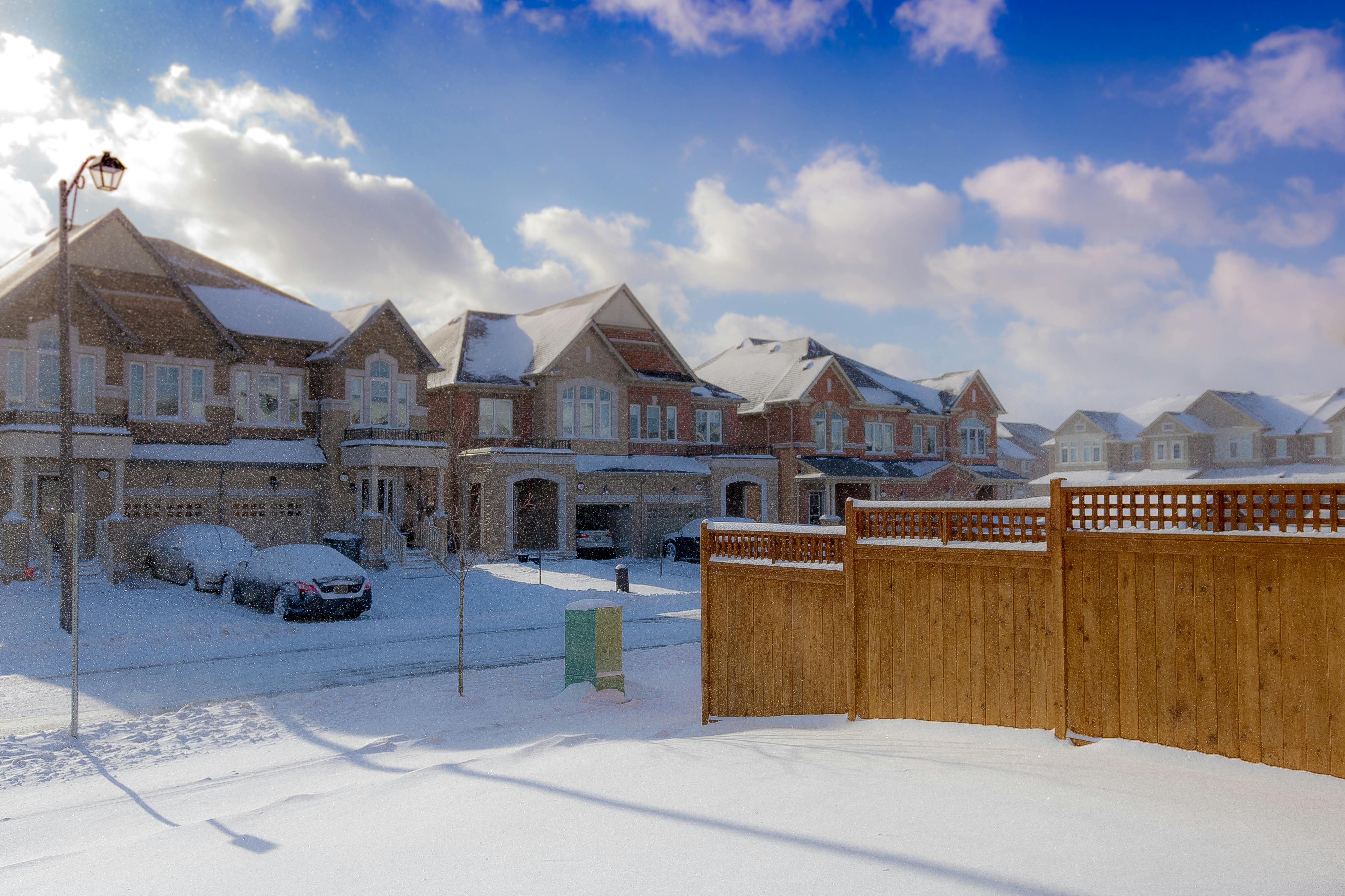 Brown 2-storey Houses during Snow · Free Stock Photo