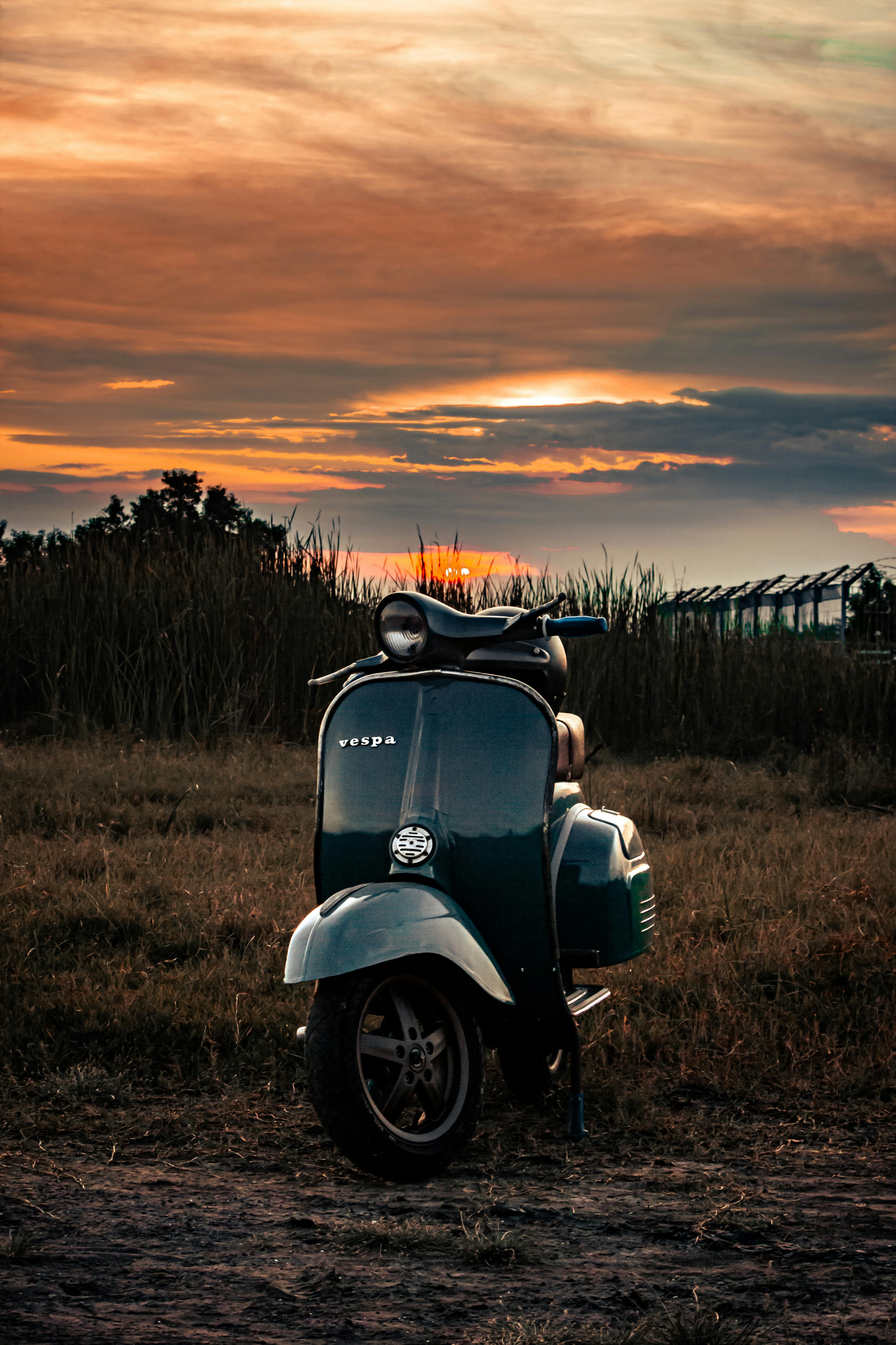 Red and Black Moped Scooter Beside Green Grass · Free Stock Photo