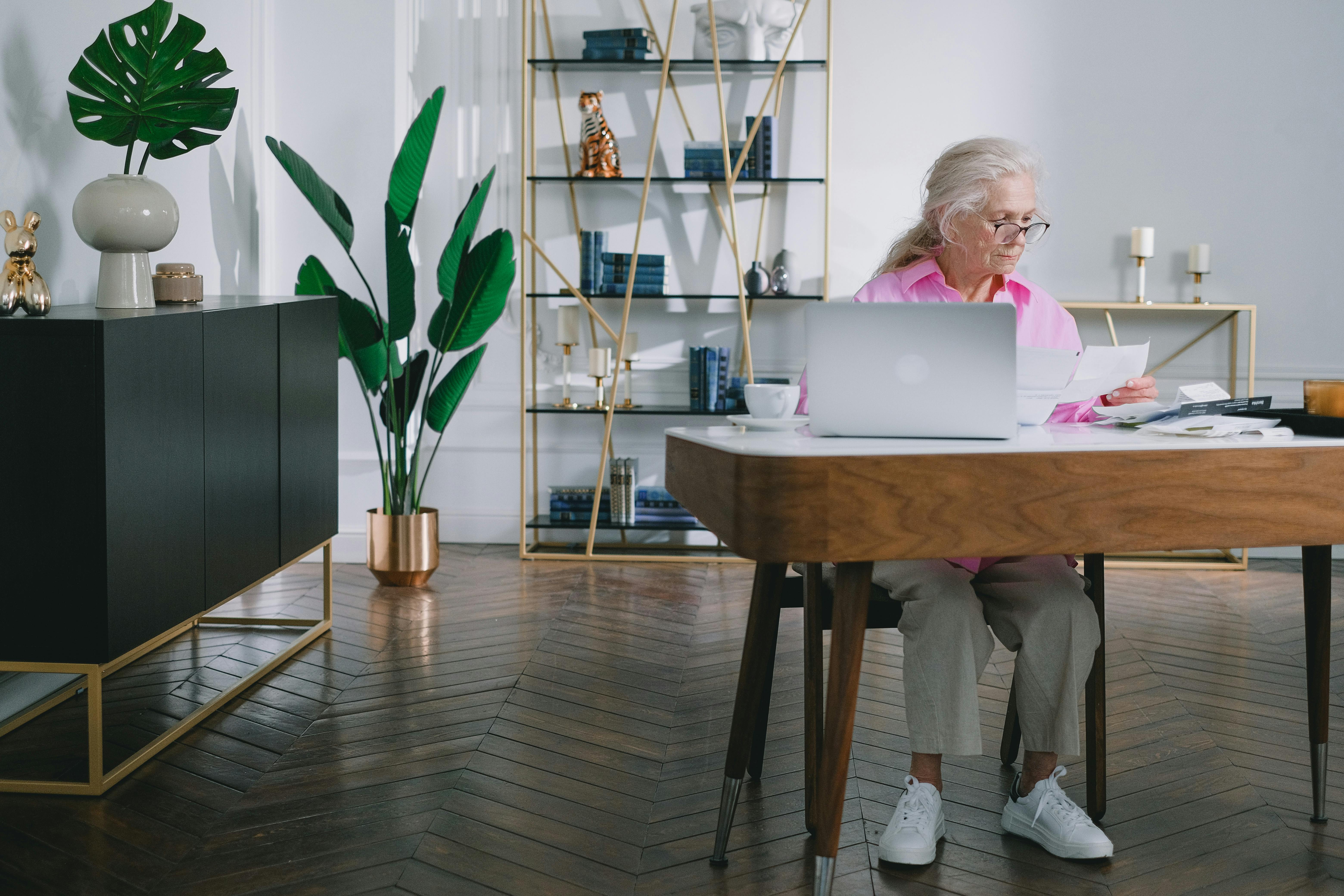 Elderly Woman Looking at Documents · Free Stock Photo