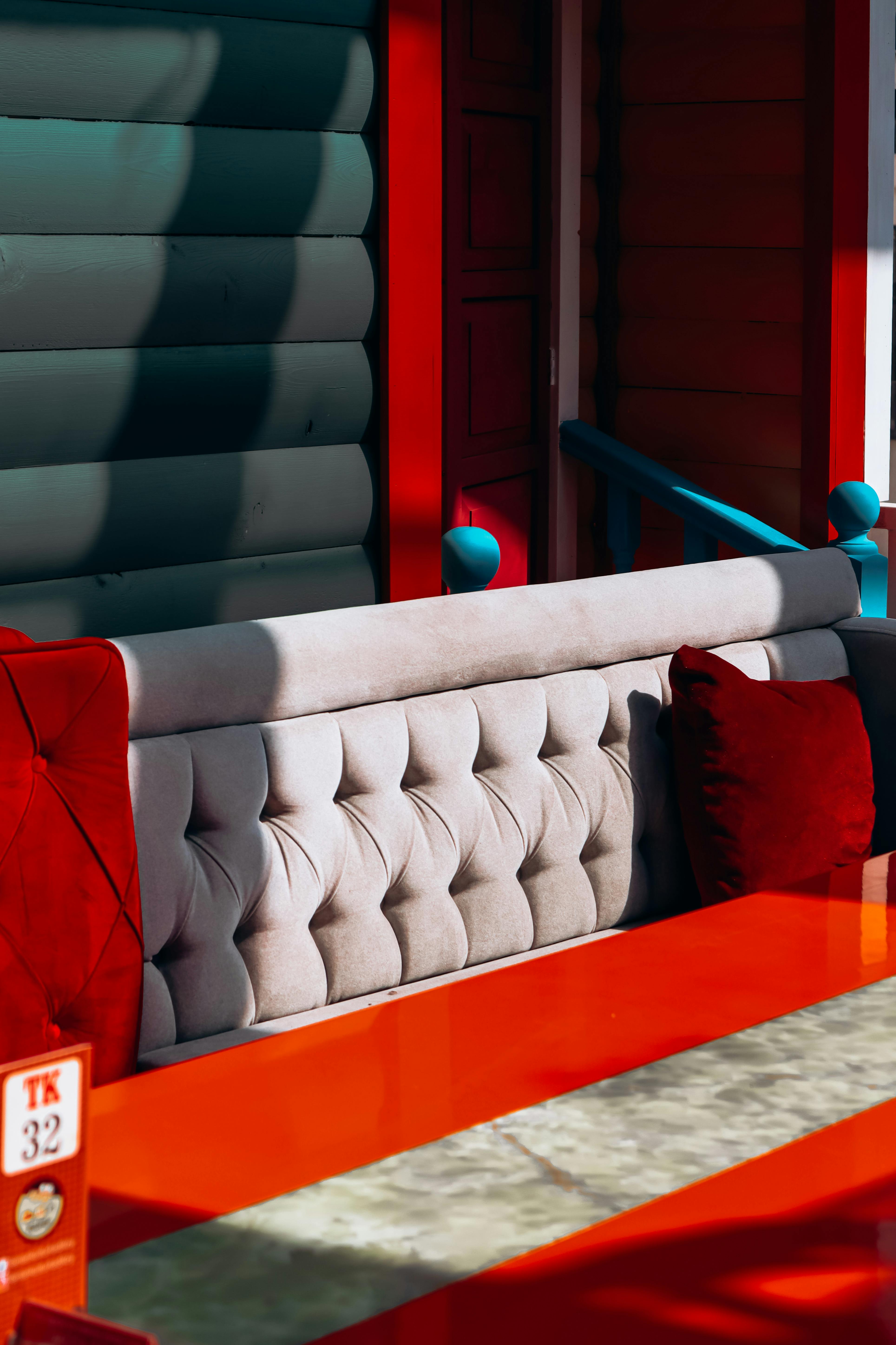 Close-up of a Padded Couch Standing in Front of a House · Free Stock Photo