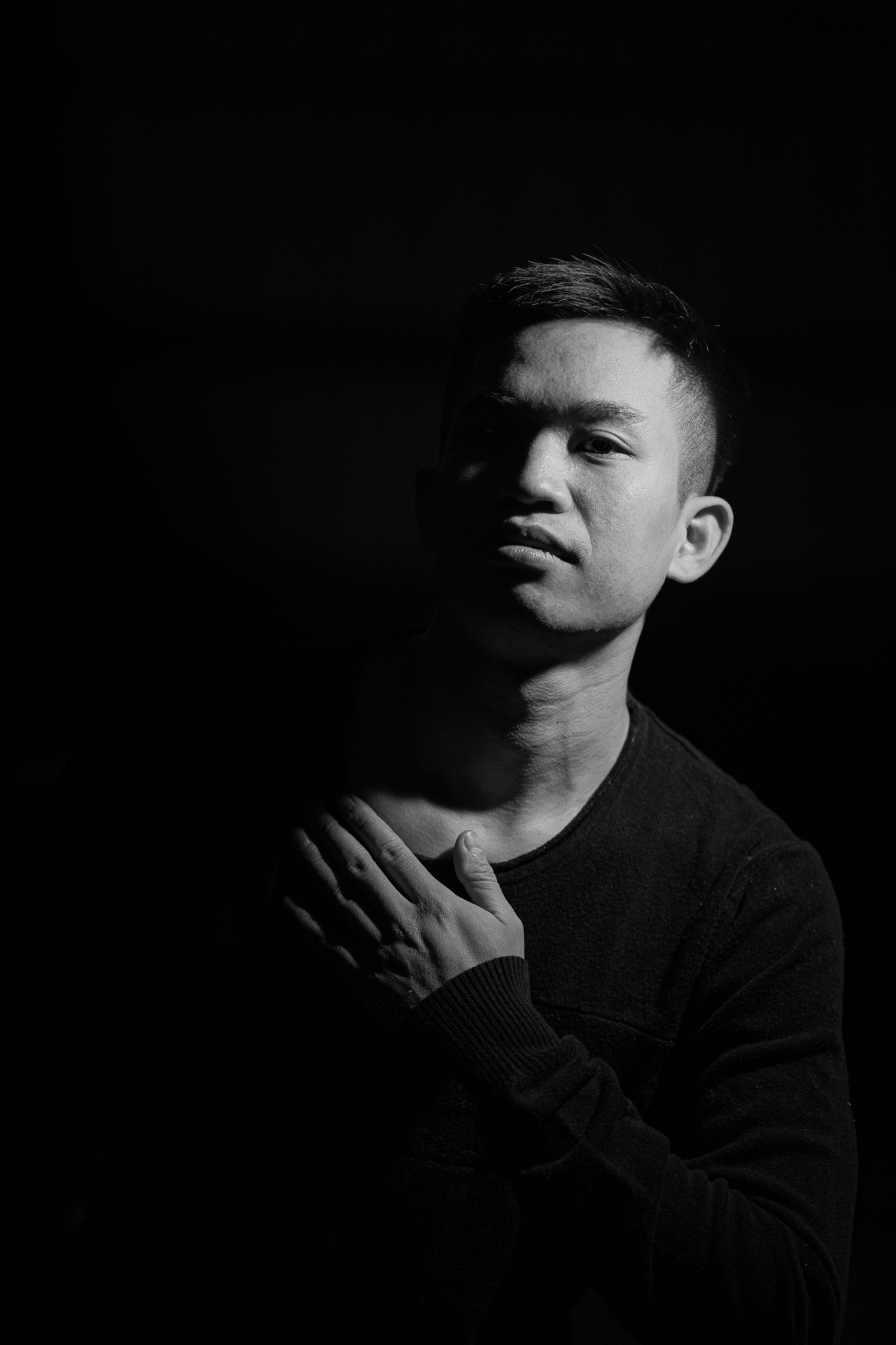 Grayscale Photo of Man Wearing Tank Top Staring at Window · Free Stock ...