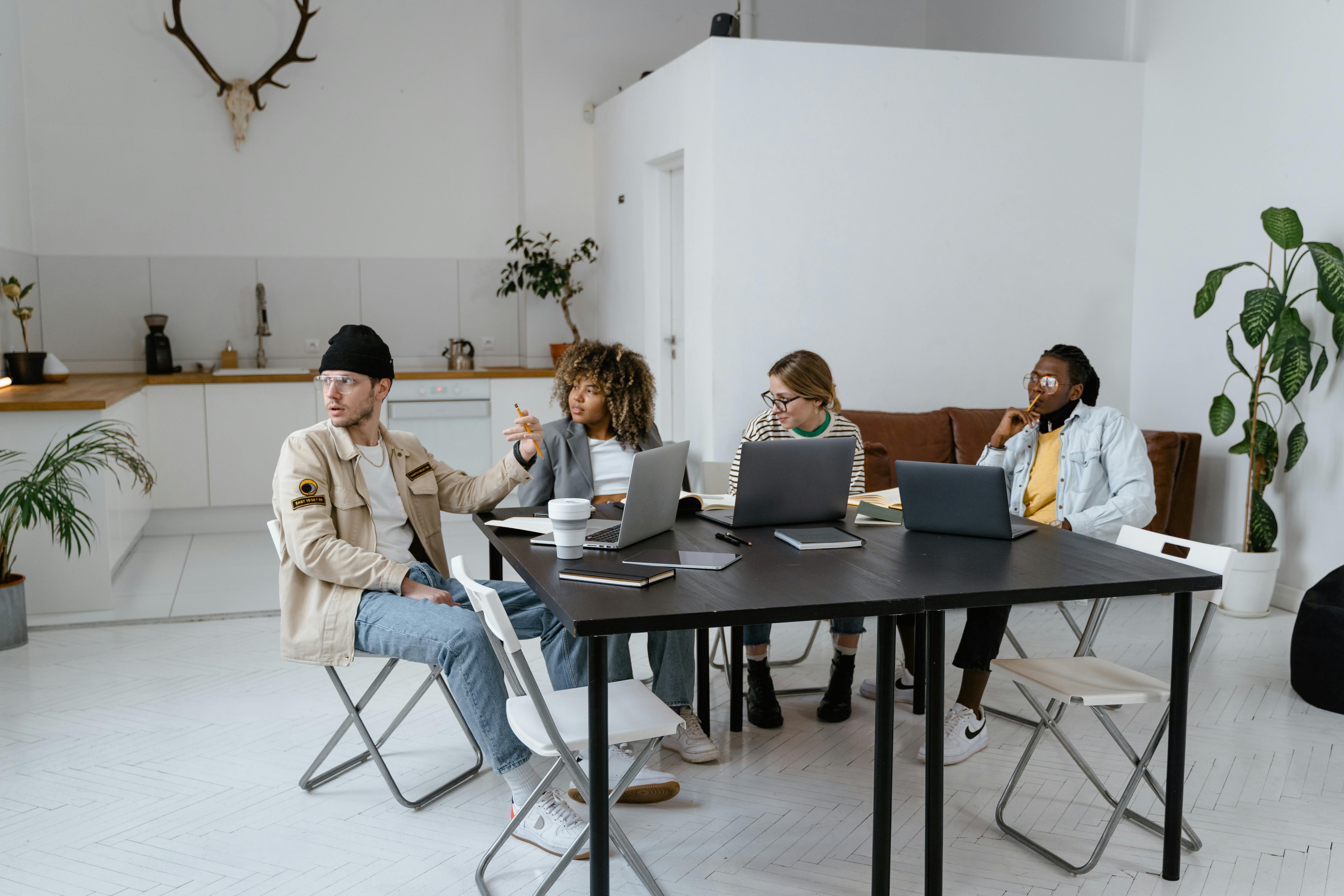People Sitting at the Table Having a Meeting · Free Stock Photo