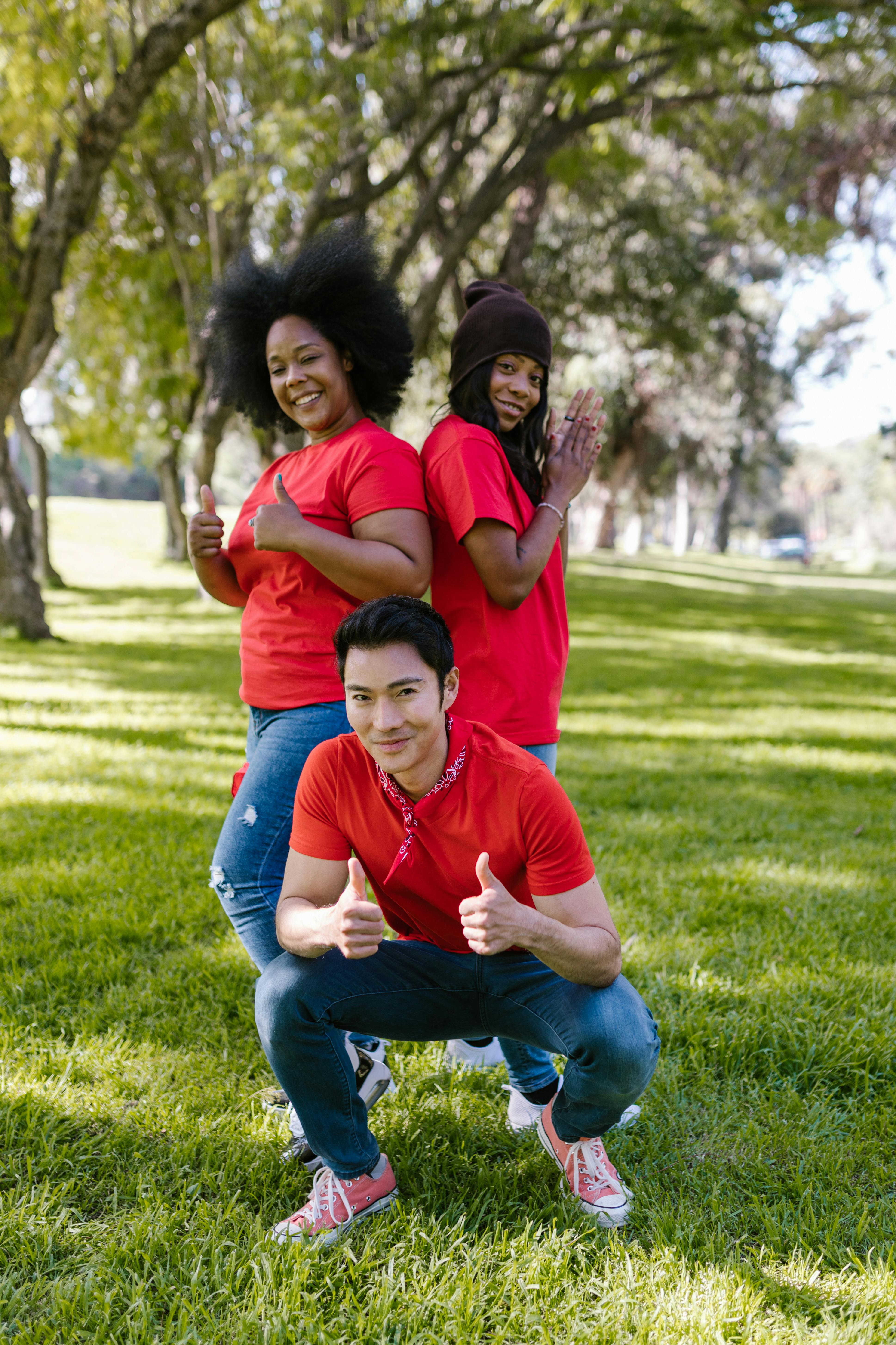 People Wearing Red Crew Neck Shirts And Posing · Free Stock Photo