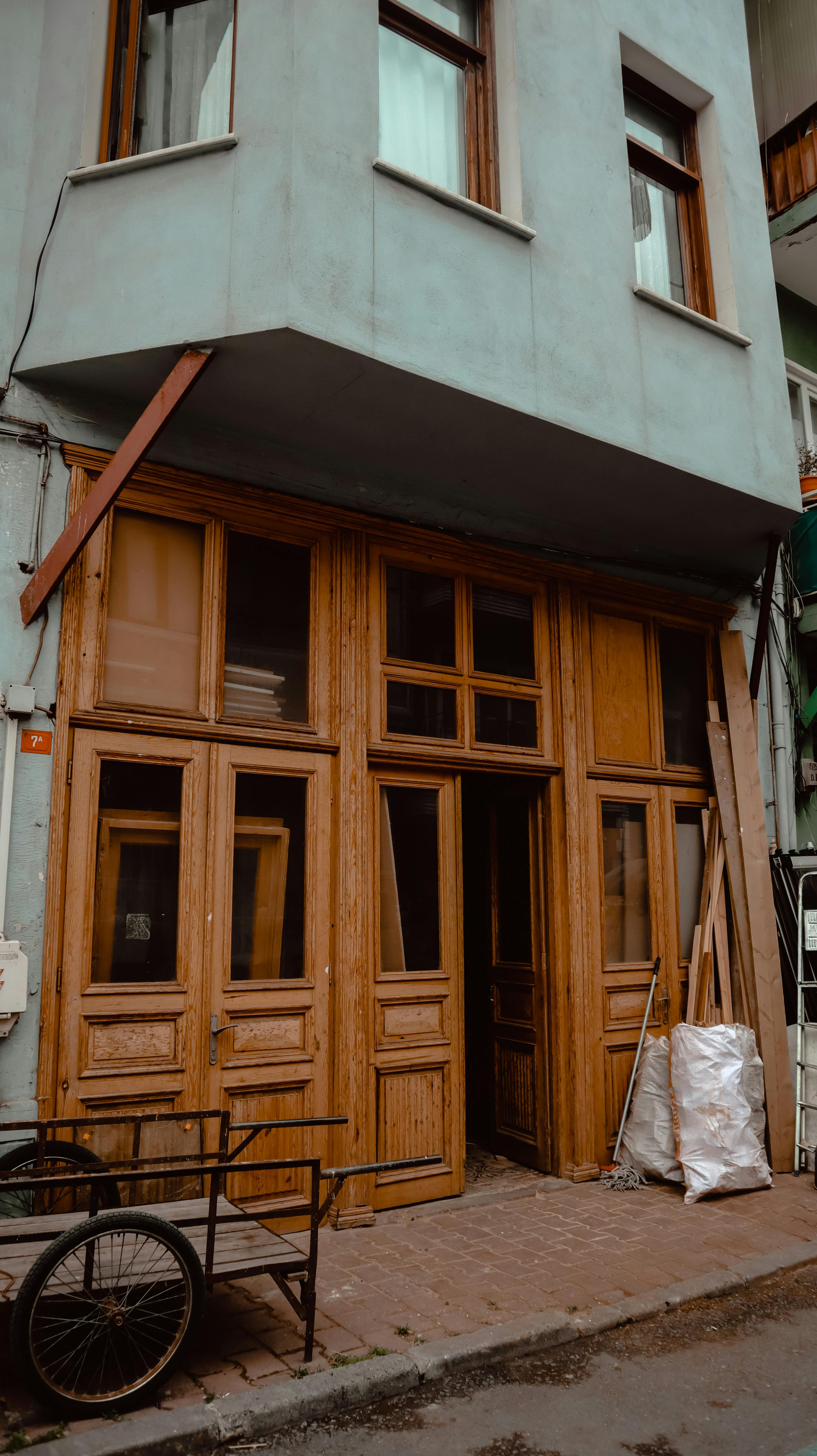 Teal Building Facade and Wooden Entrance in Refurbishment · Free Stock ...
