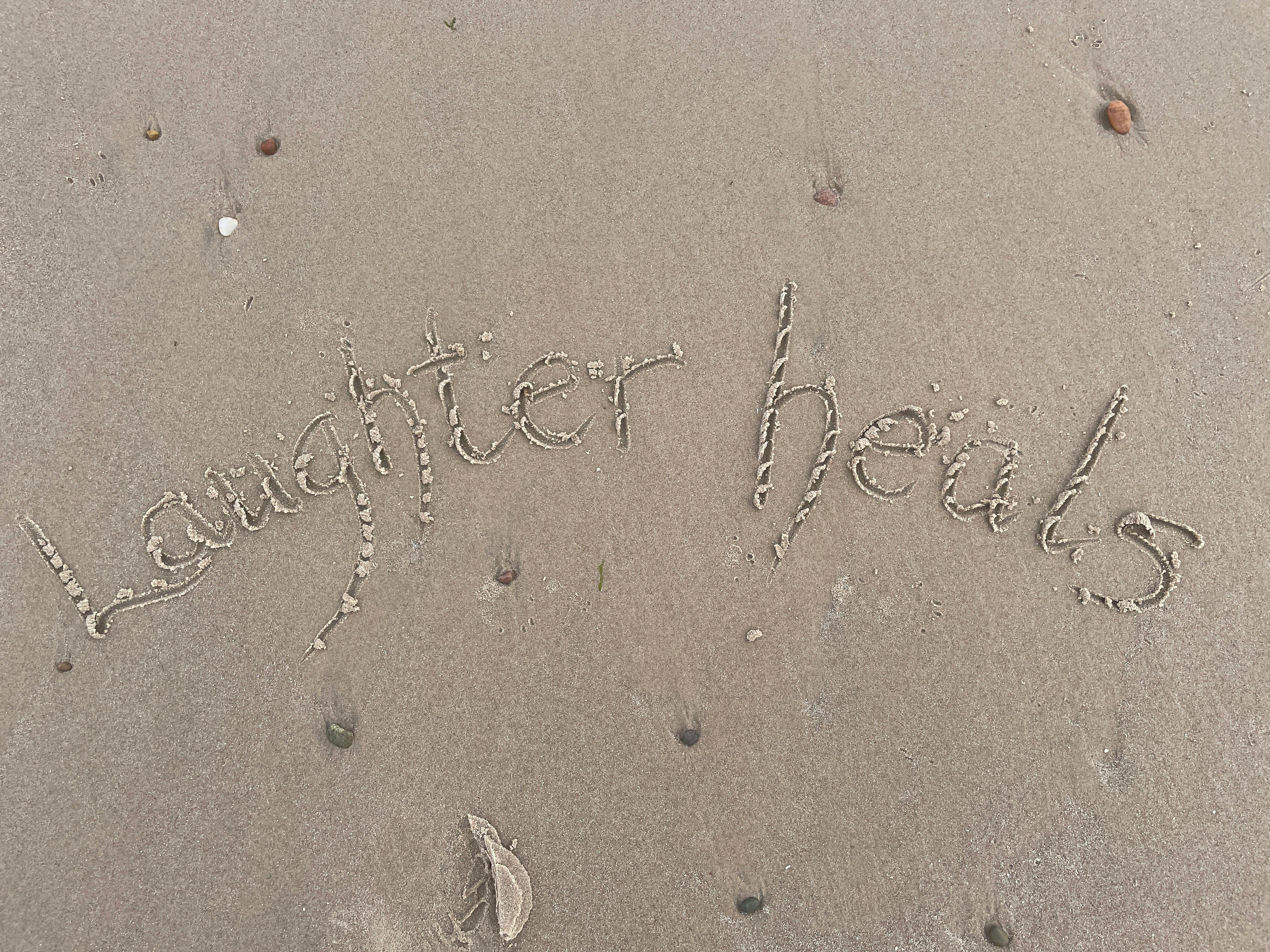 Laughter Heals Sand Calligraphy · Free Stock Photo