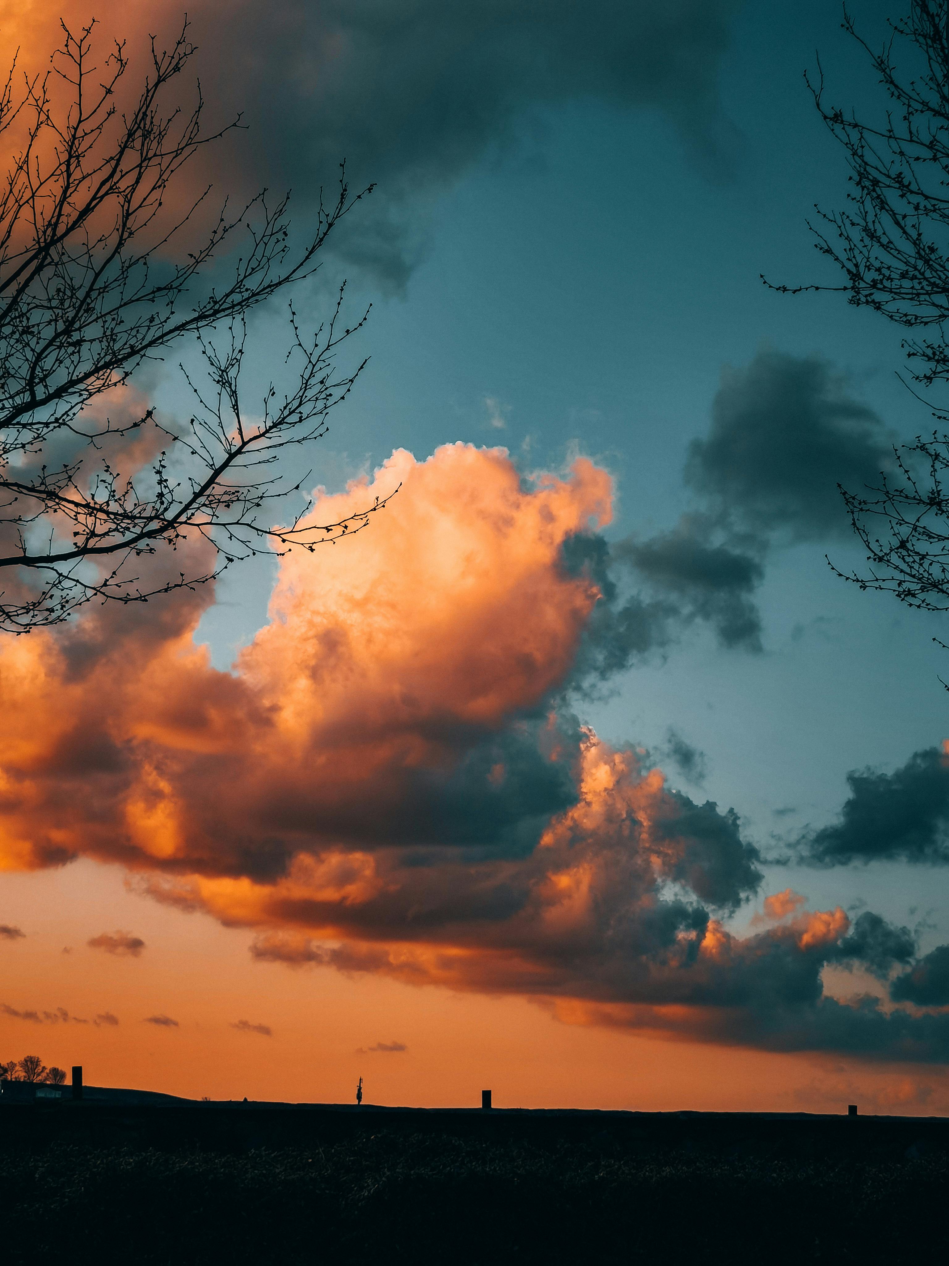 Dramatic sunset sky over countryside · Free Stock Photo