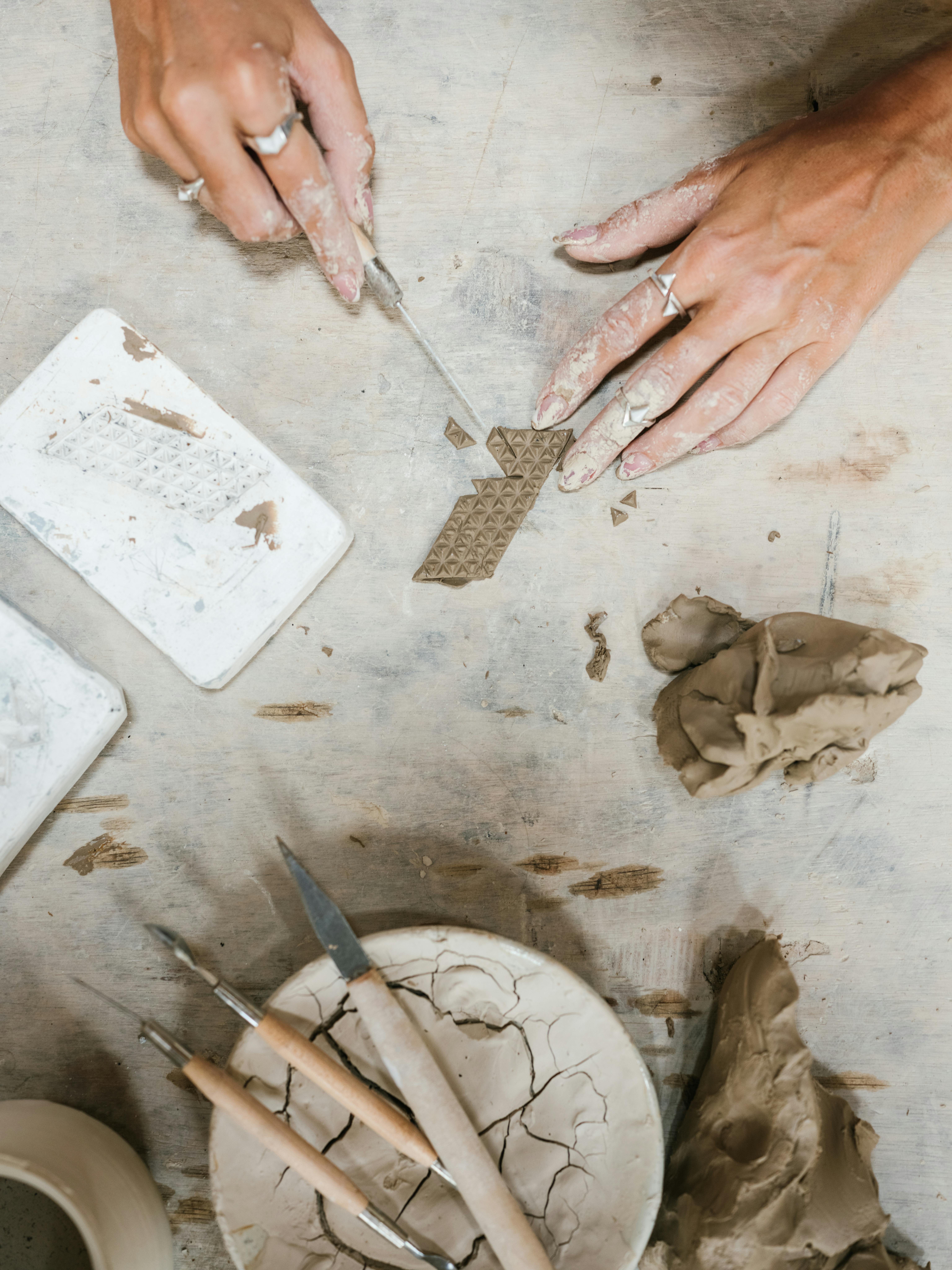 Woman Cutting Piece of Clay with Knife · Free Stock Photo