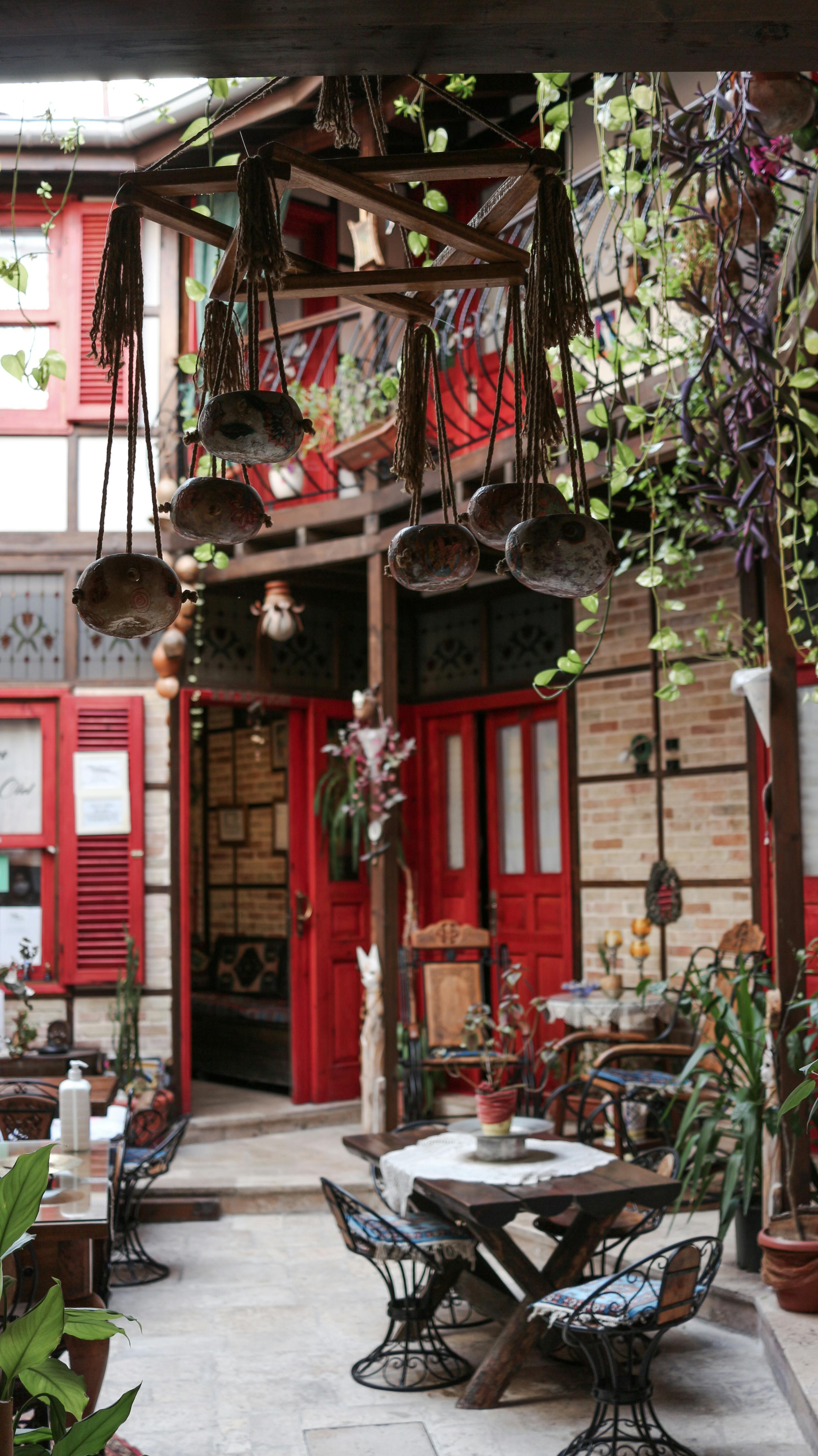 Old cafe with furniture and lamps in daylight · Free Stock Photo
