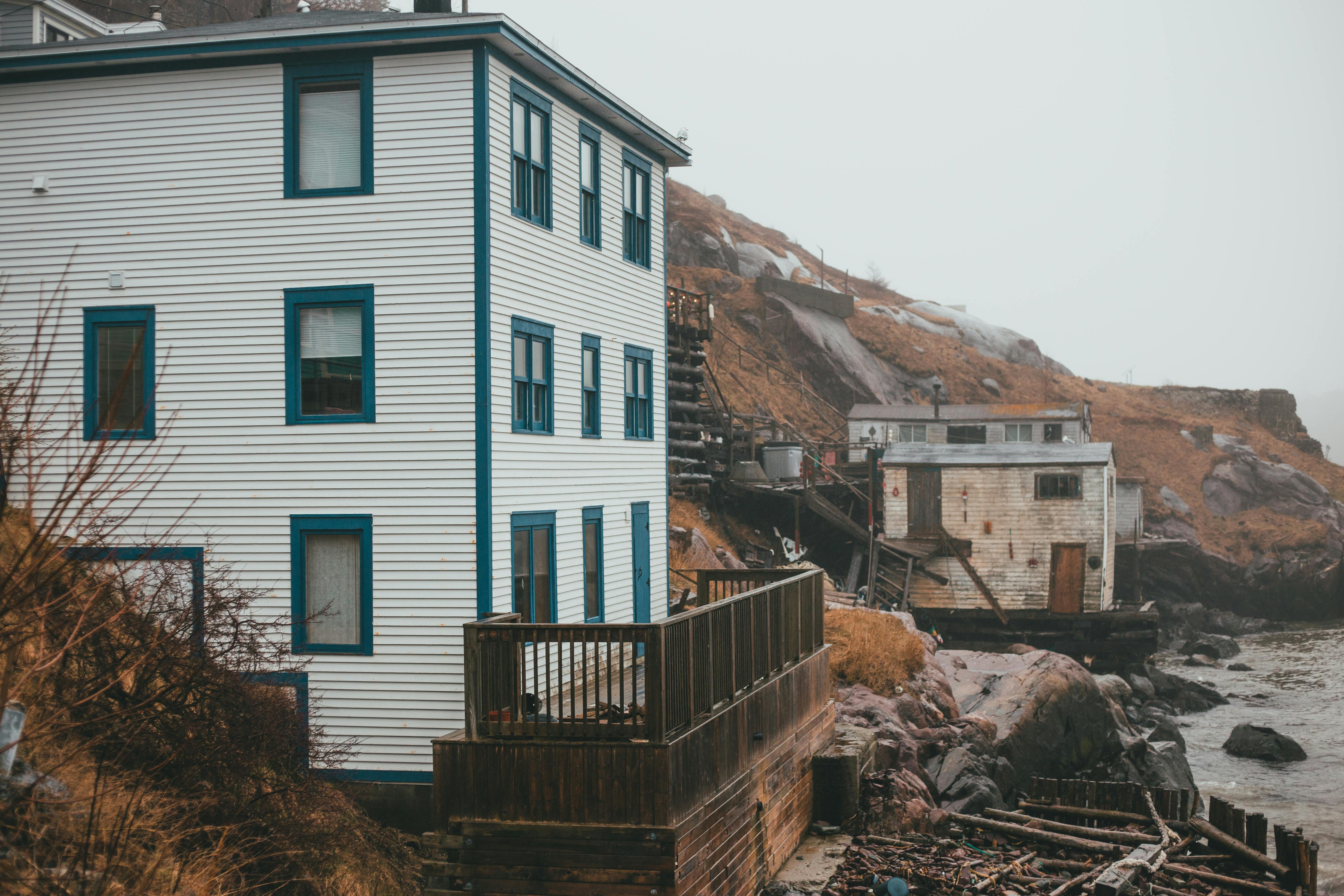 Buildings on shore near river · Free Stock Photo