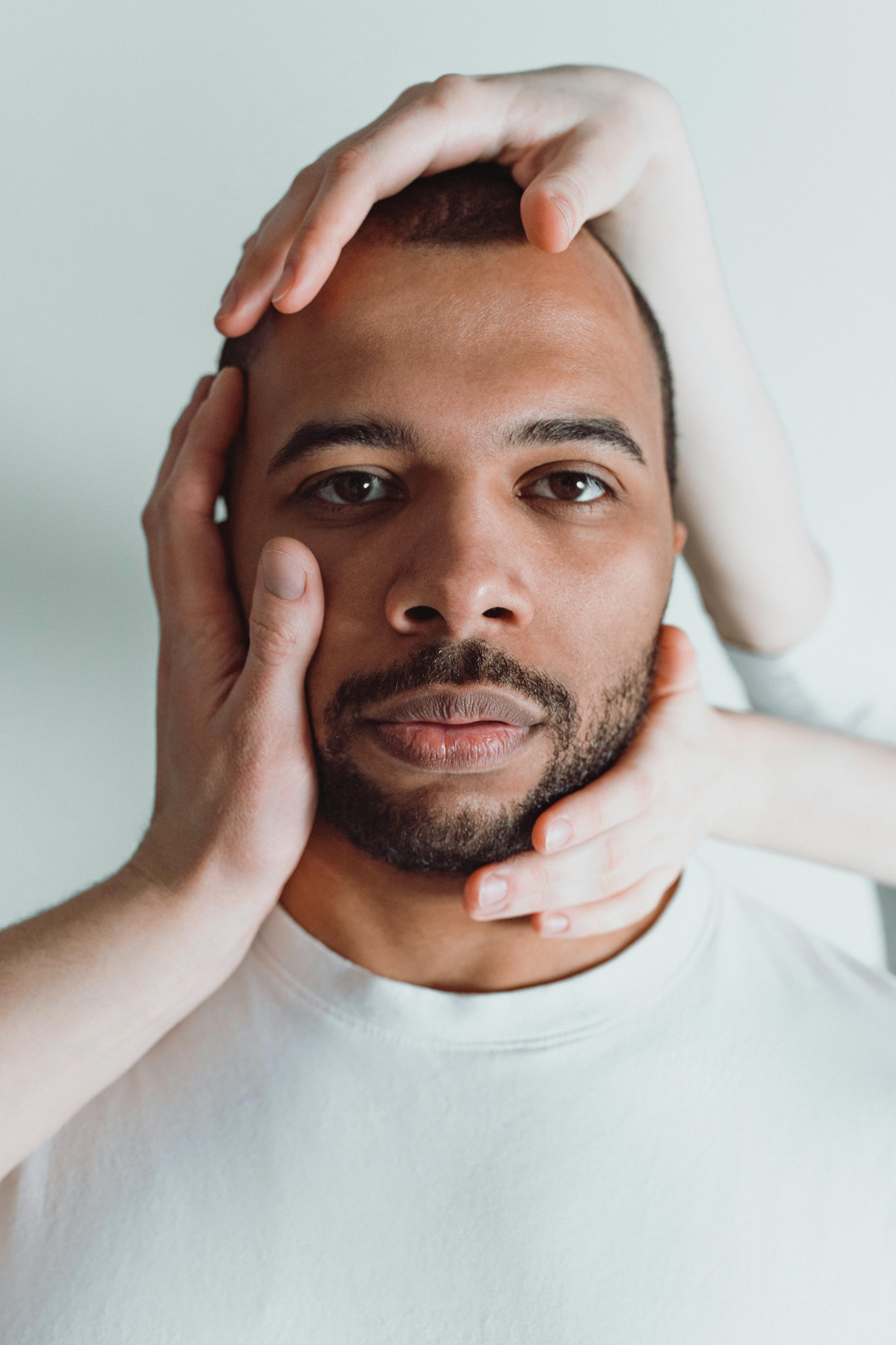 A Man Getting His Face Touched · Free Stock Photo