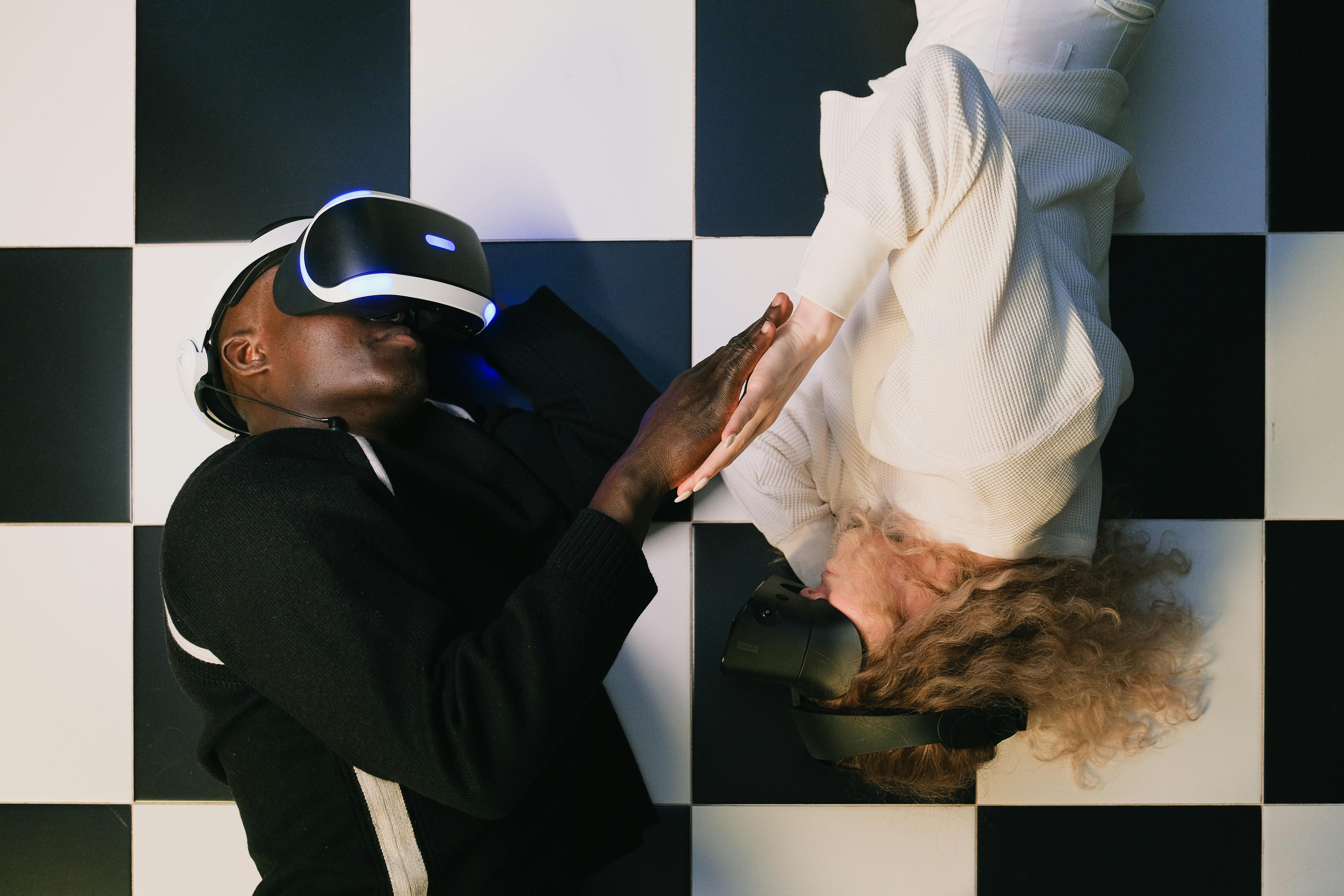 Two People Lying Down with Virtual Reality Headsets · Free Stock Photo