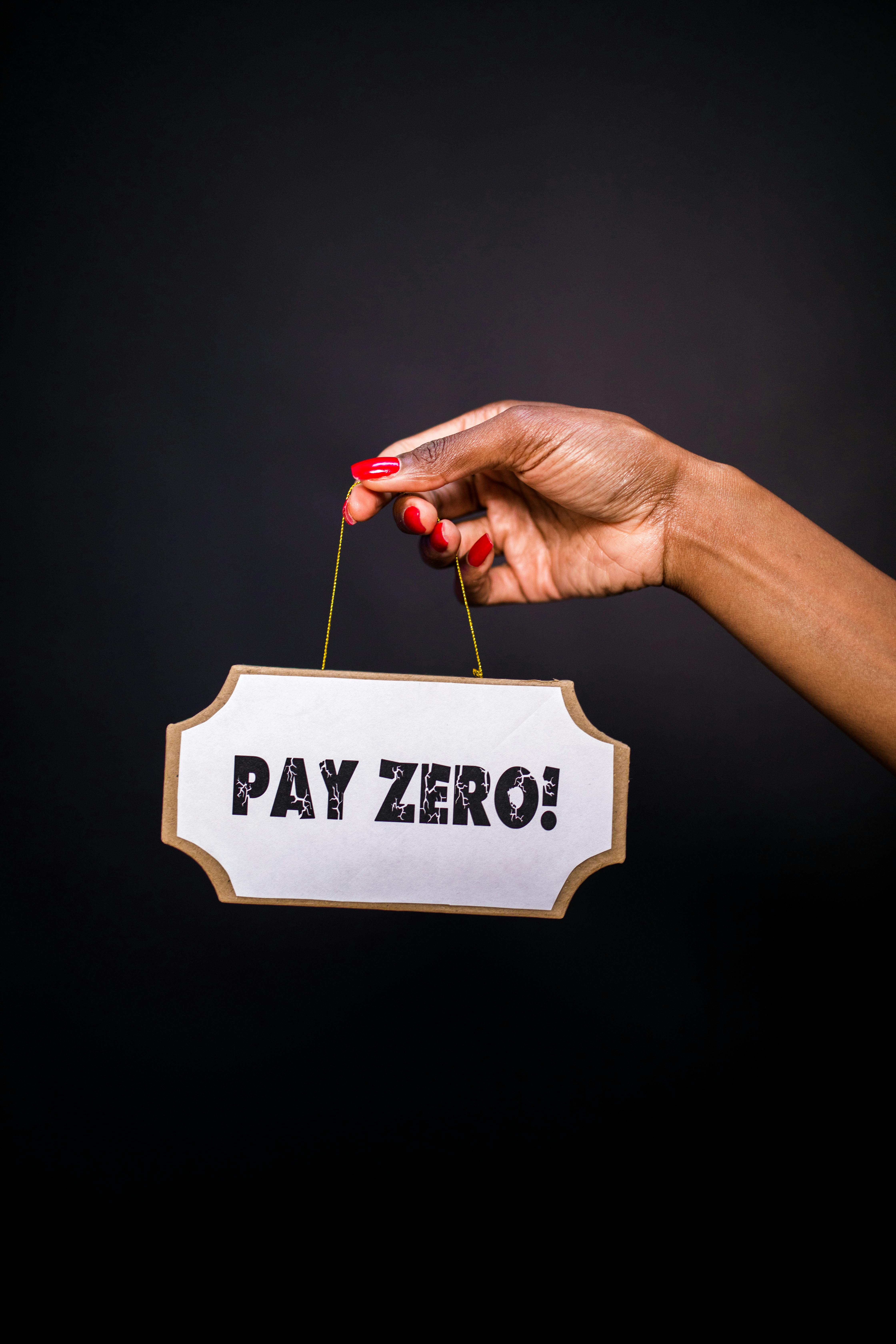 Person Holding Marketing Signage · Free Stock Photo