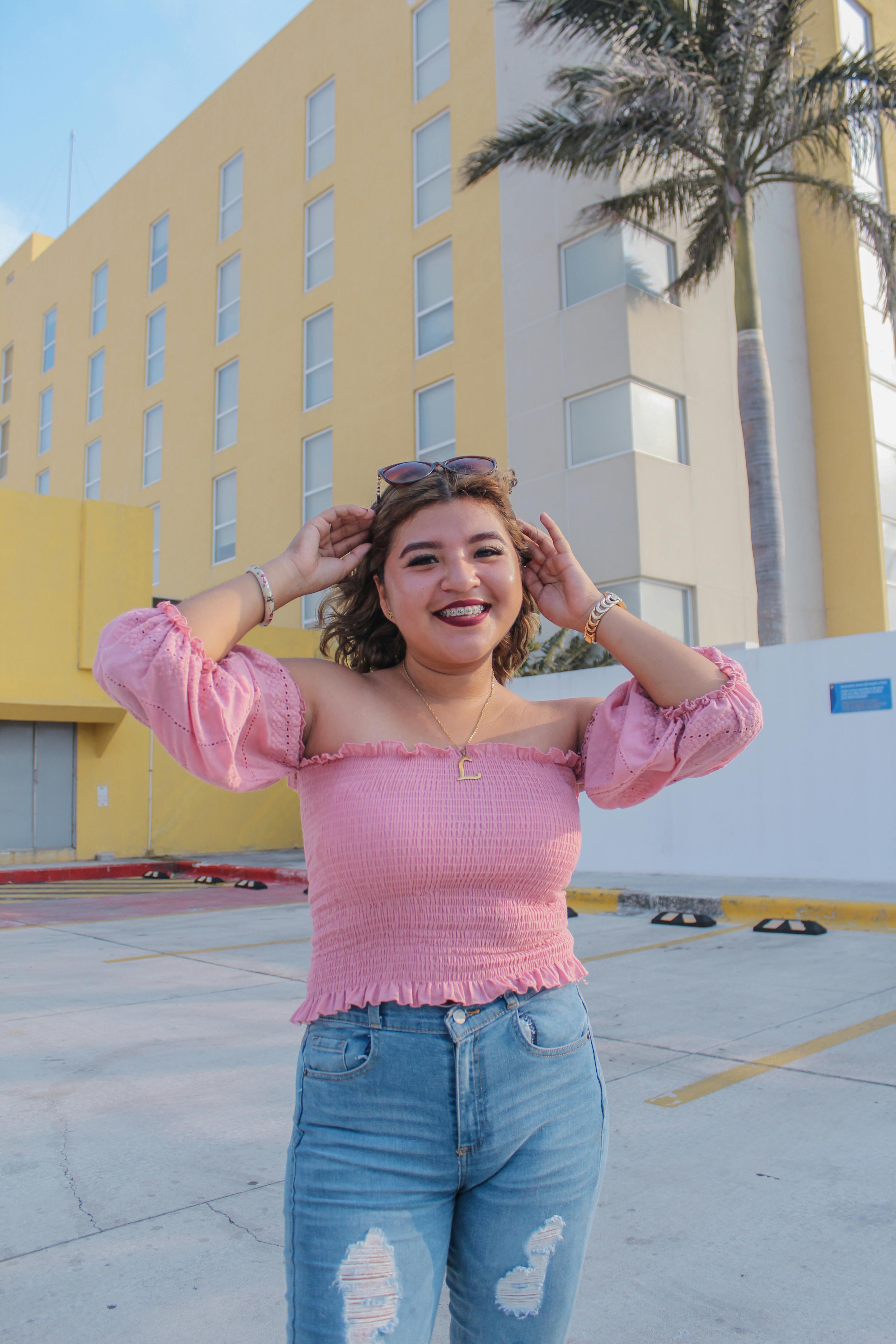 A Pretty Woman in Pink Off Shoulder Top · Free Stock Photo