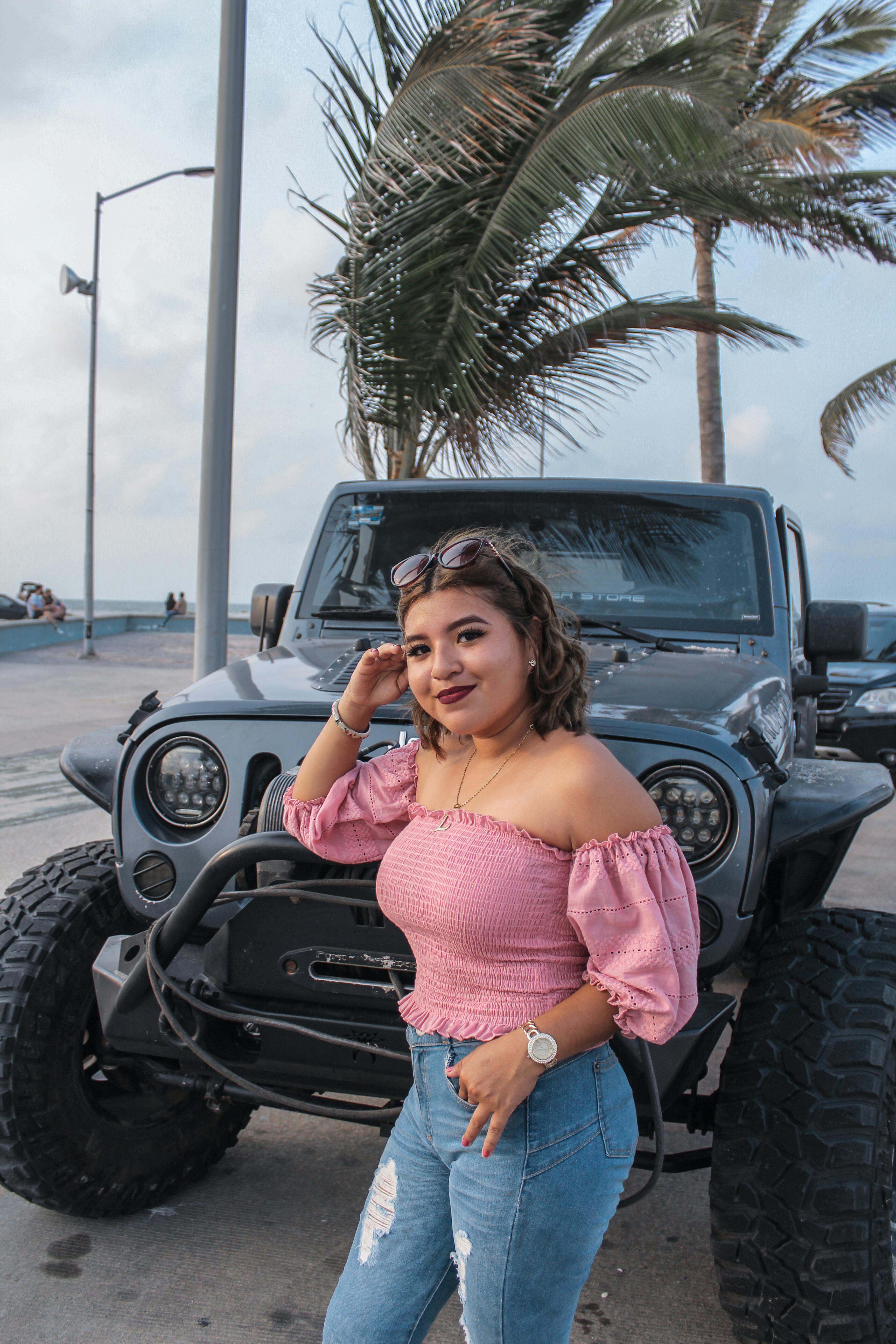 Woman Posing by Willys Jeep Truck · Free Stock Photo