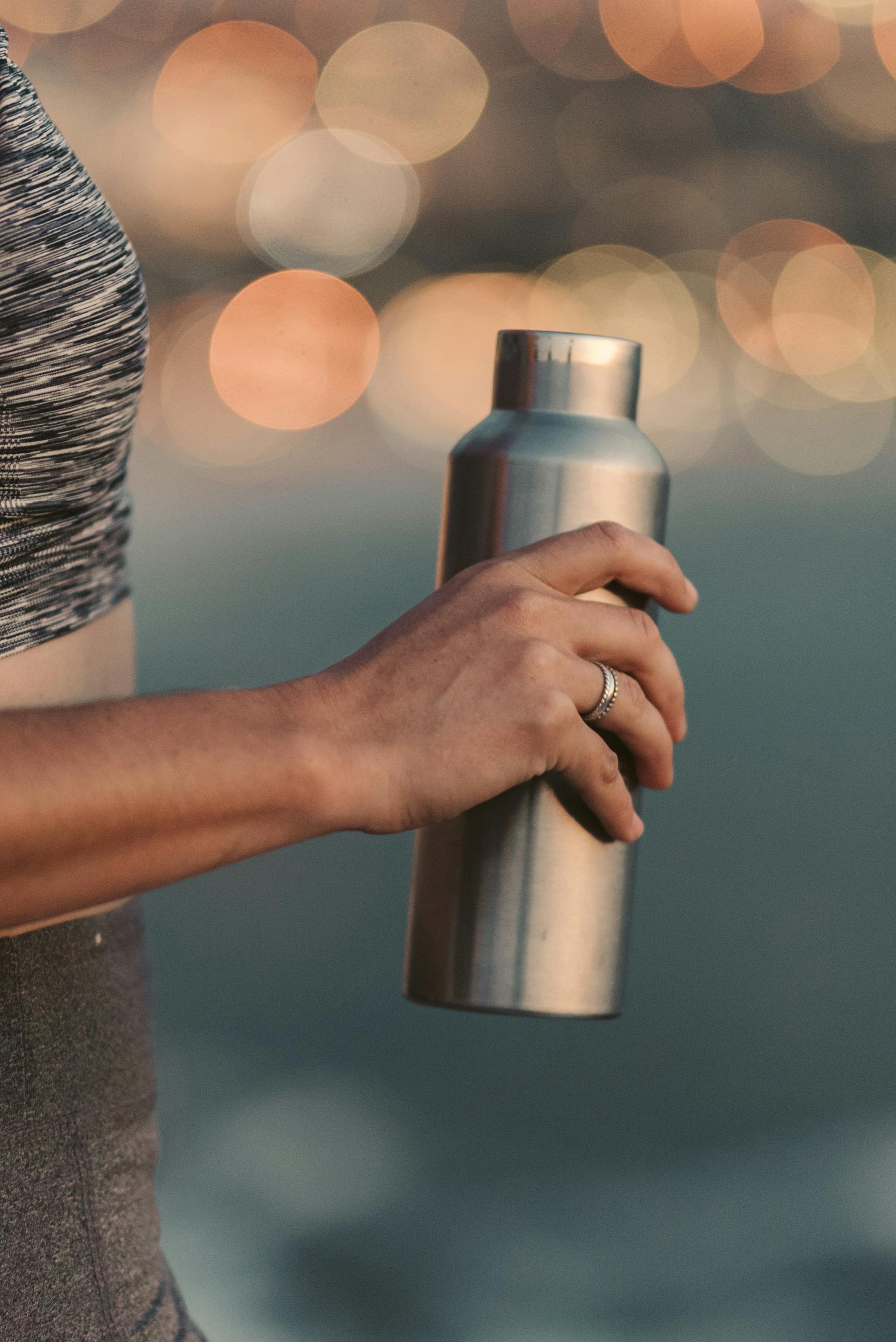 Person Holding Stainless Steel Vacuum Flask · Free Stock Photo